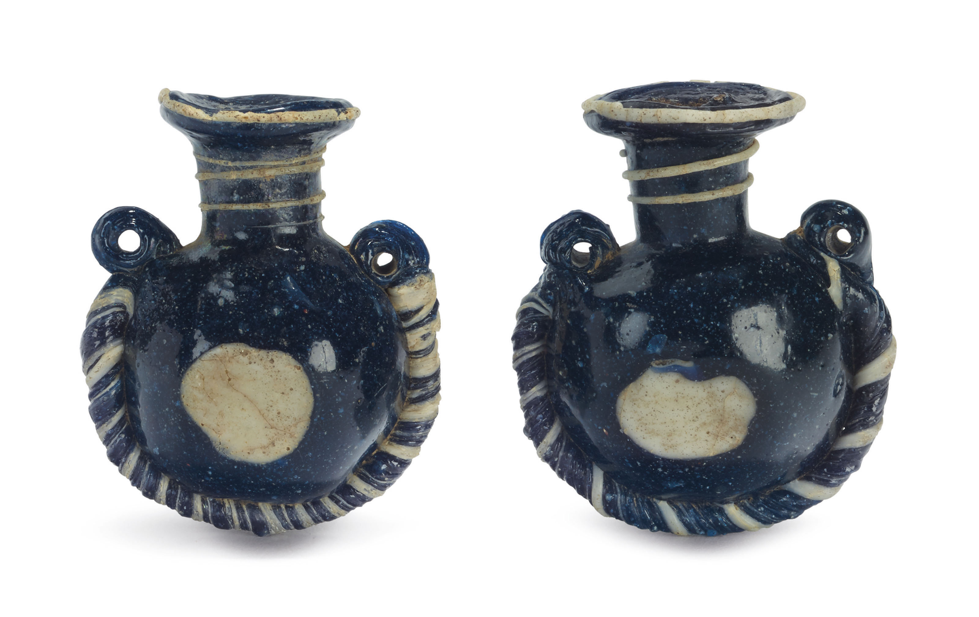 THREE CARTHAGINIAN GLASS HEAD BEADS, CIRCA 6TH-MID 2ND CENTURY B.C ...