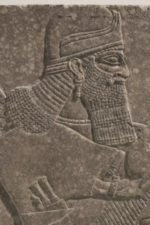 AN ASSYRIAN GYPSUM RELIEF OF A WINGED GENIUS, REIGN OF ASHURNASIRPAL II ...