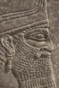 AN ASSYRIAN GYPSUM RELIEF OF A WINGED GENIUS, REIGN OF ASHURNASIRPAL II ...