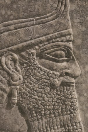 AN ASSYRIAN GYPSUM RELIEF OF A WINGED GENIUS, REIGN OF ASHURNASIRPAL II ...