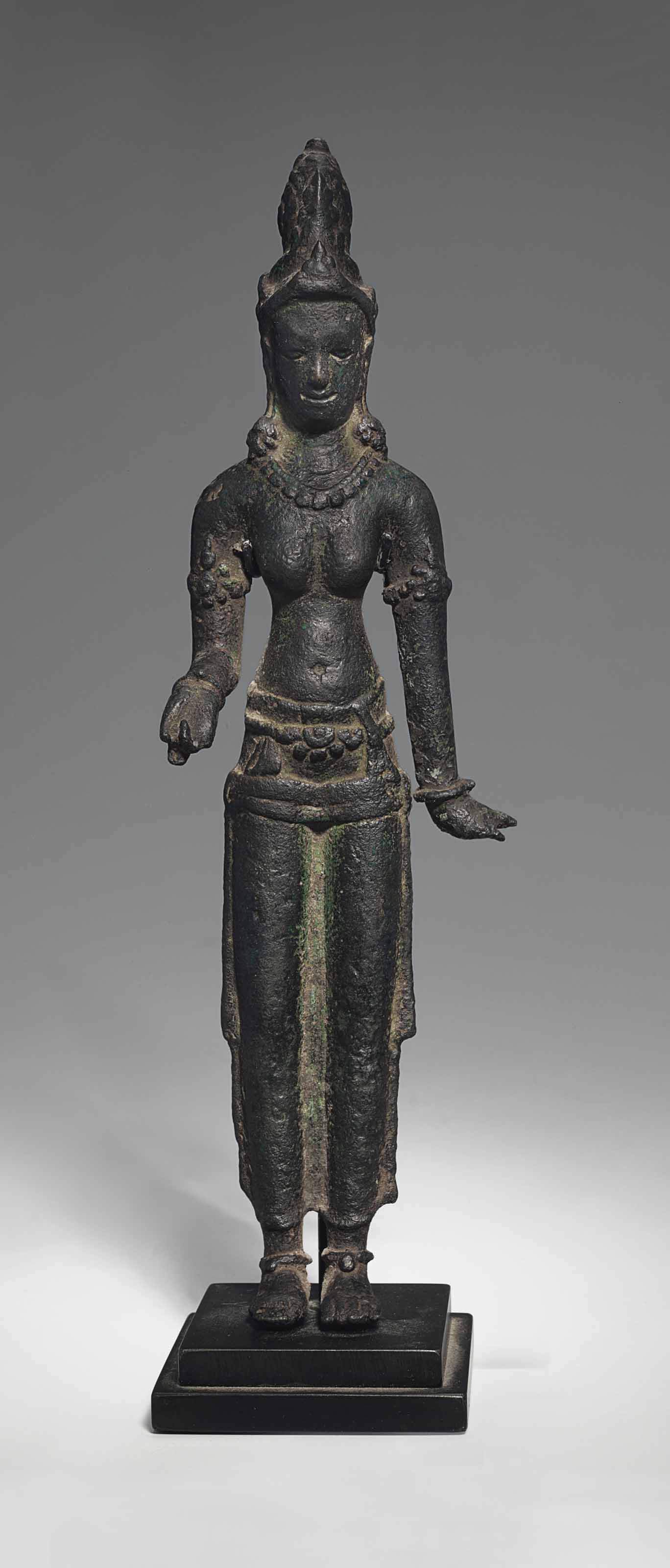 A BRONZE FIGURE OF A FEMALE DEITY