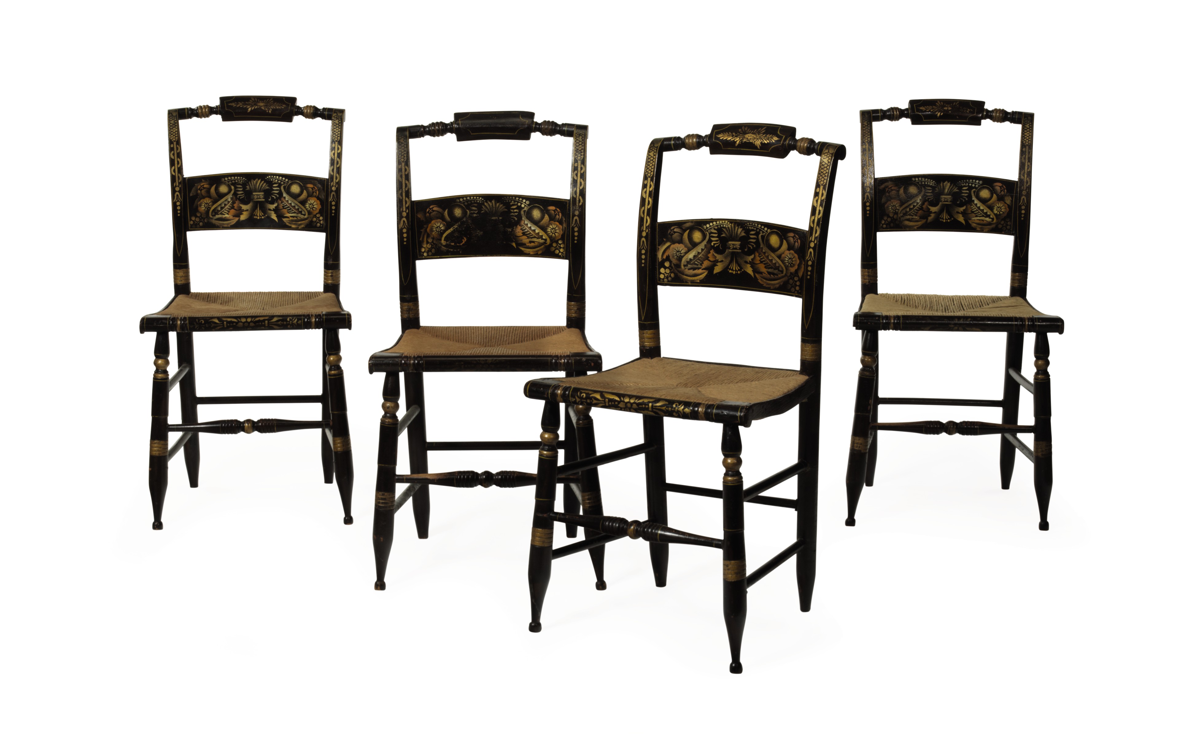 A SET OF FOUR AMERICAN BLACK-PAINTED AND STENCIL-DECORATED SIDE CHAIRS ...