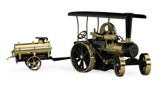 A WILESCO BRASS AND BLACK-PAINTED TIN PLATE STEAM TRACTOR AND WATER ...