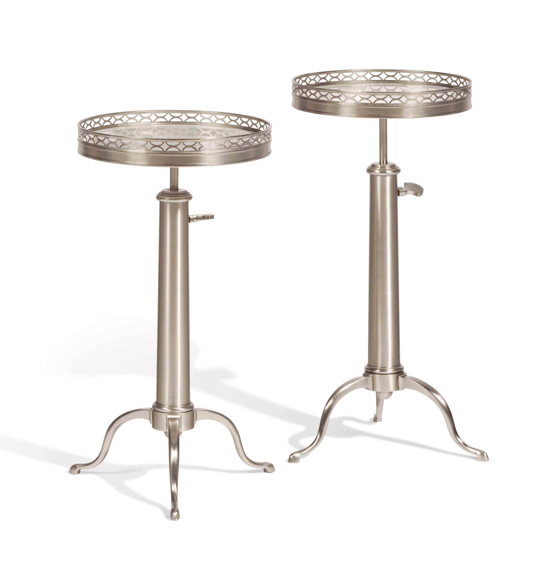 A PAIR OF FRENCH SILVERED-METAL TELESCOPING TABLES, SUPPLIED BY MAISON ...