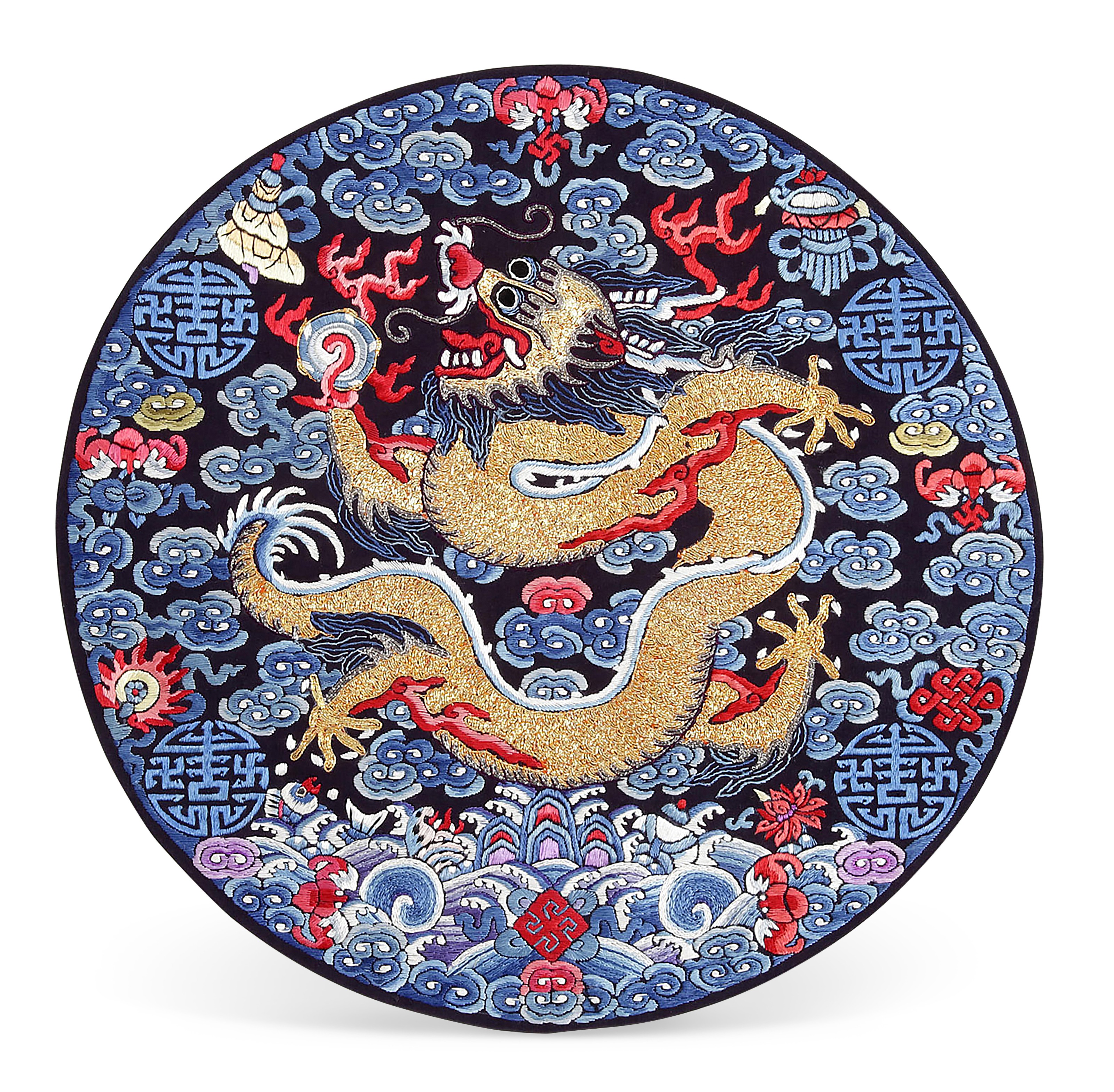 AN EMBROIDERED NAVY BLUE SILK DRAGON ROUNDEL, LATE QING DYNASTY ...