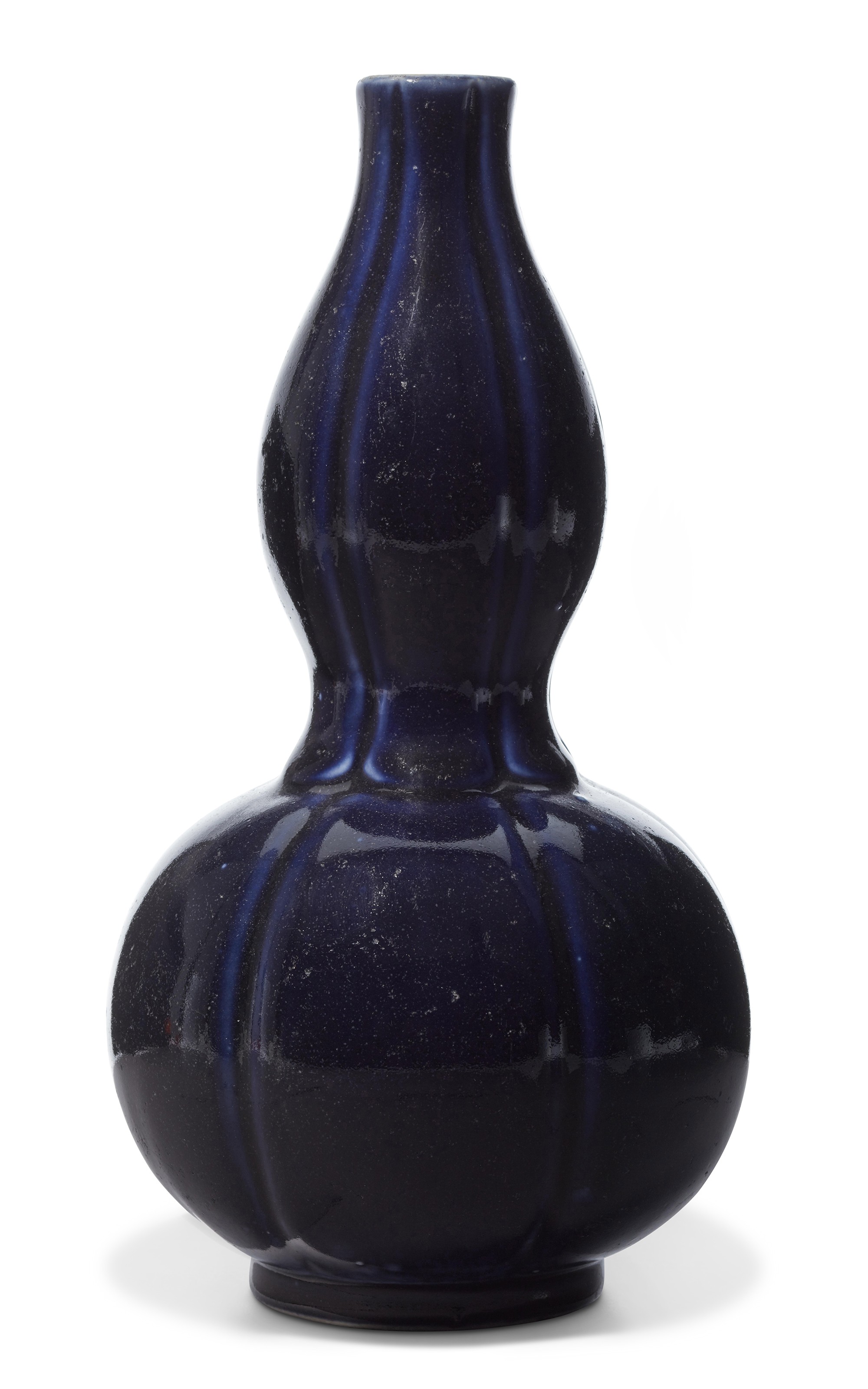 A BLUE-GLAZED LOBED DOUBLE GOURD VASE, 18TH CENTURY | Christie’s