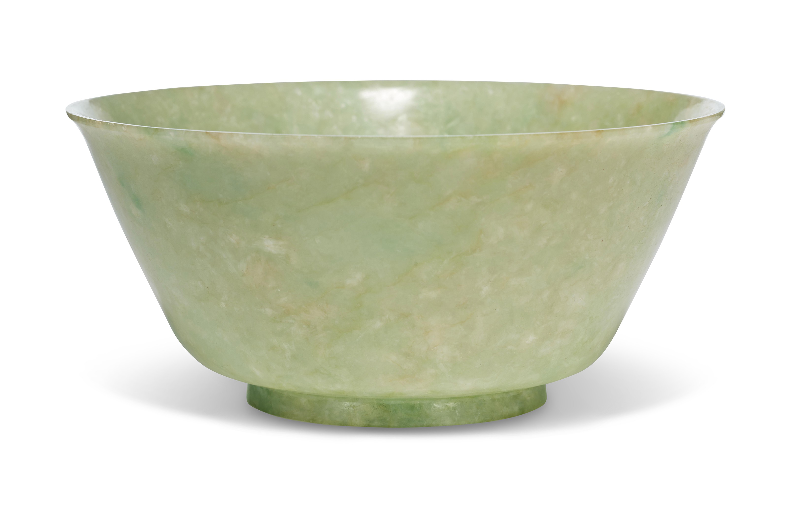 A MOTTLED GREEN JADEITE BOWL, | Christie’s