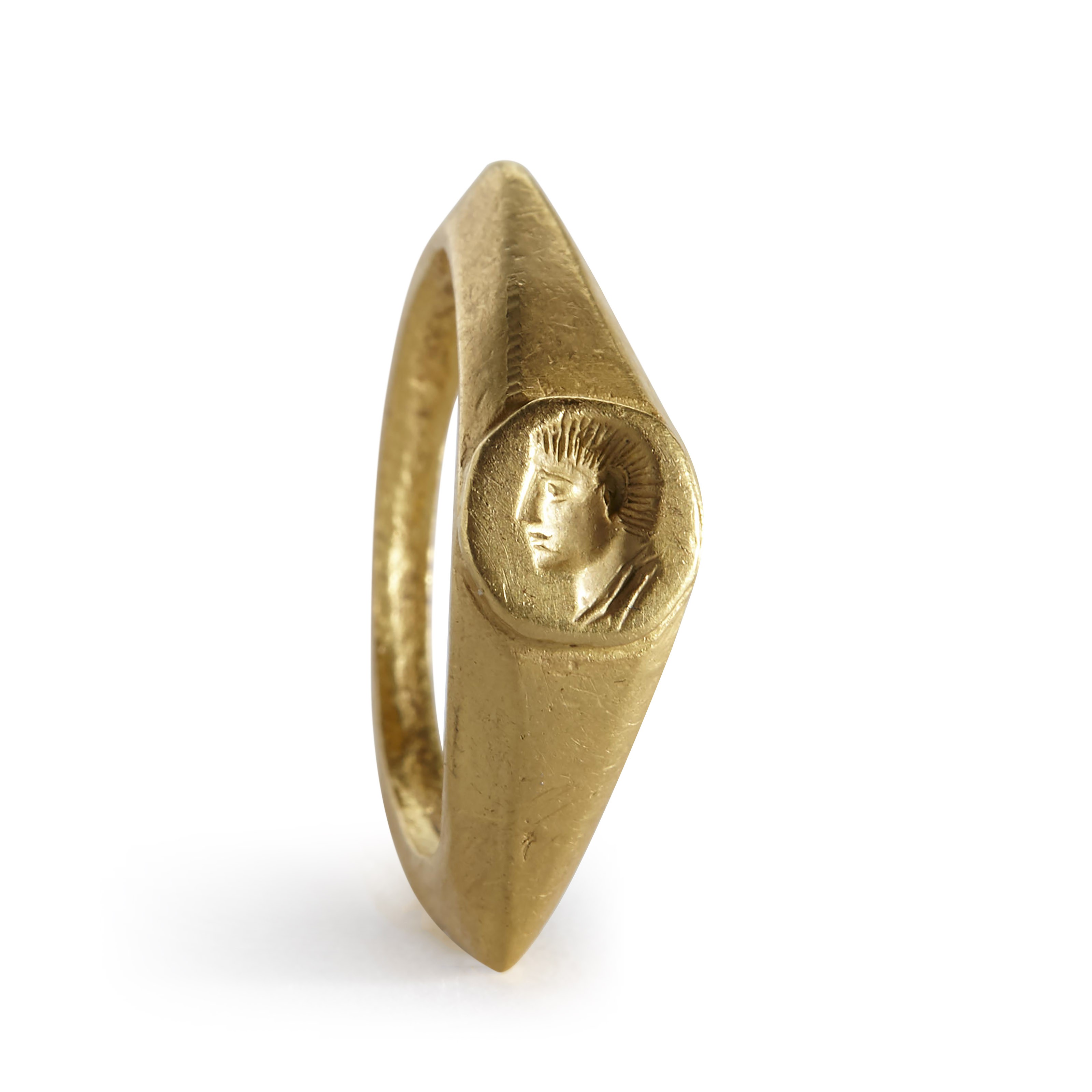 A ROMAN GOLD FINGER RING WITH A PROFILE MALE HEAD, CIRCA 3RD CENTURY A ...
