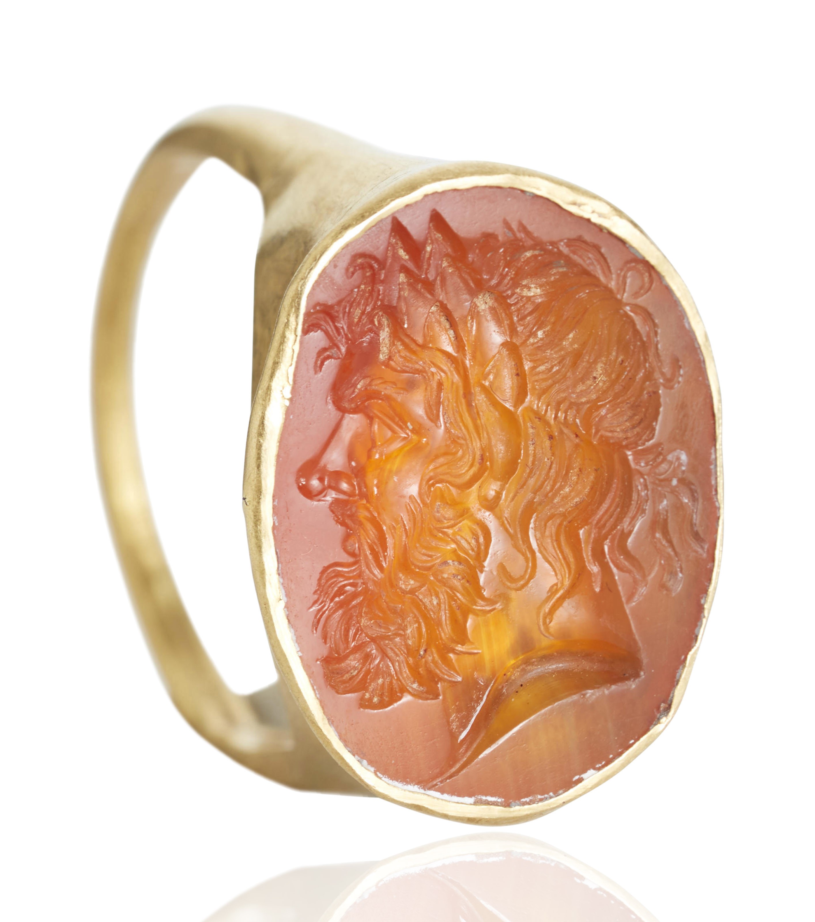 A ROMAN GOLD AND CARNELIAN FINGER RING WITH A SATYR, CIRCA 1ST CENTURY ...