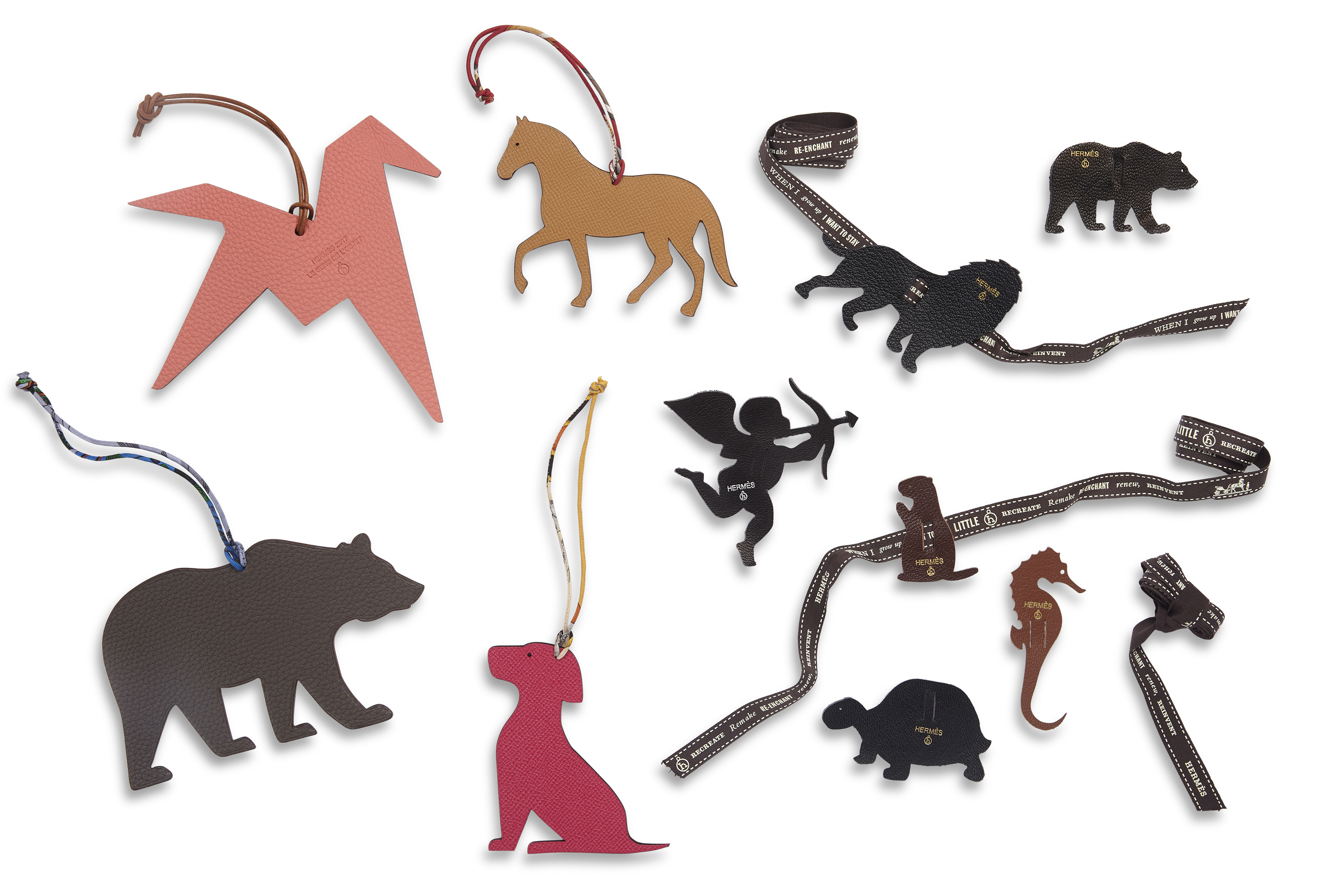 A SET OF FOUR: LEATHER PETIT H ANIMAL CHARMS AND SIX PETIT H RIBBON ...