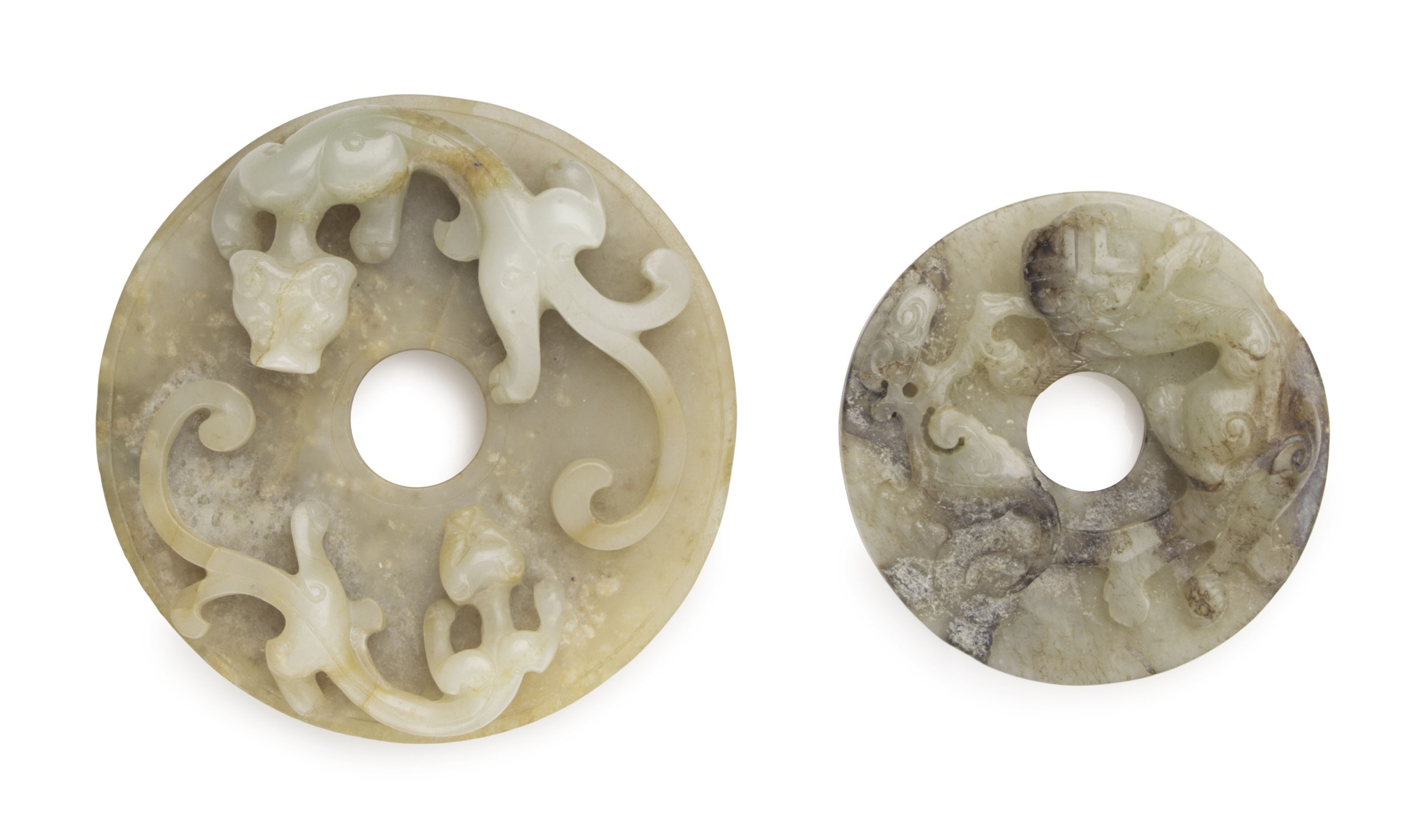 A MOTTLED PALE GREYISH-WHITE AND BROWN JADE FIGURE OF A RABBIT, MING ...