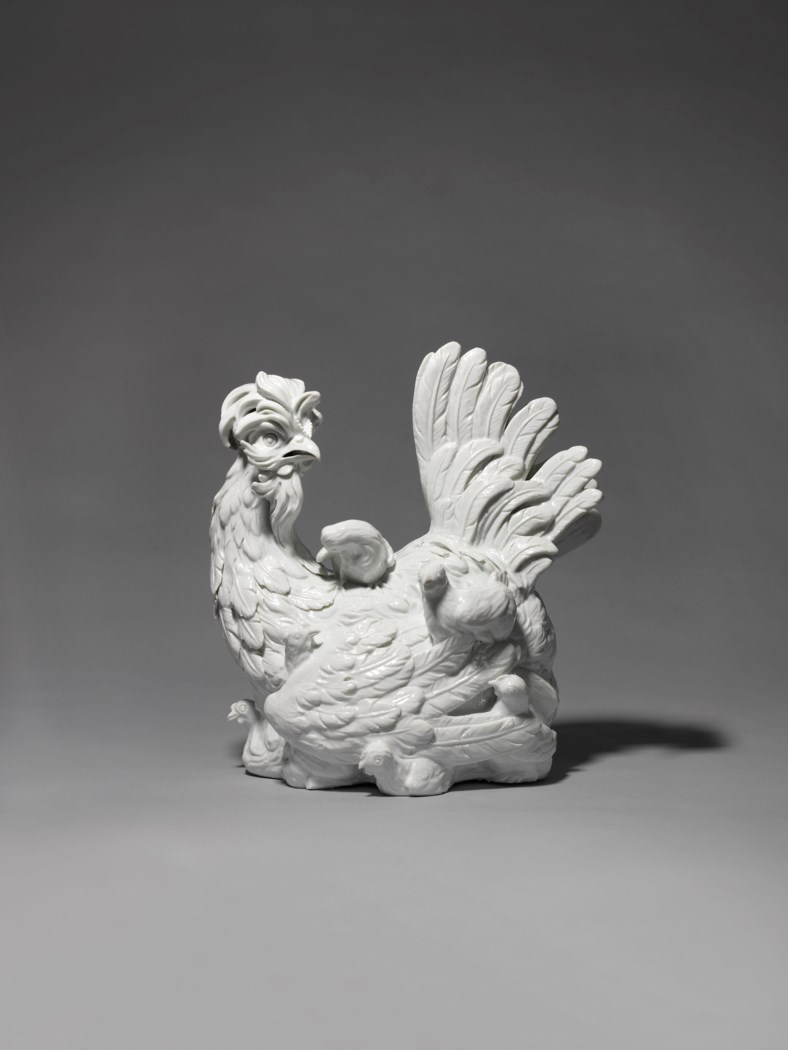 A MEISSEN WHITE PORCELAIN MODEL OF A HEN WITH HER CHICKS