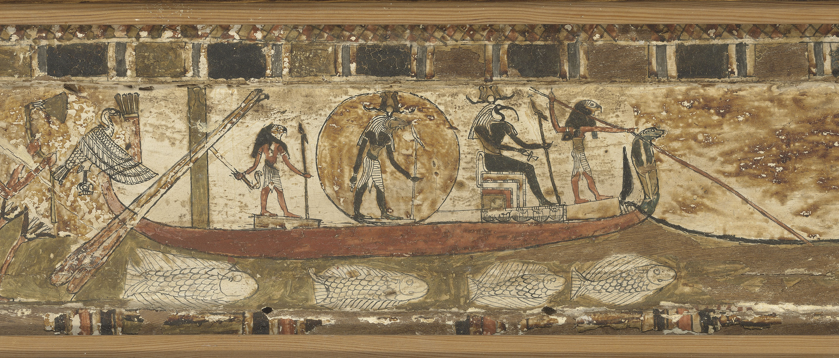 AN EGYPTIAN POLYCHROME PAINTED WOOD SARCOPHAGUS PANEL