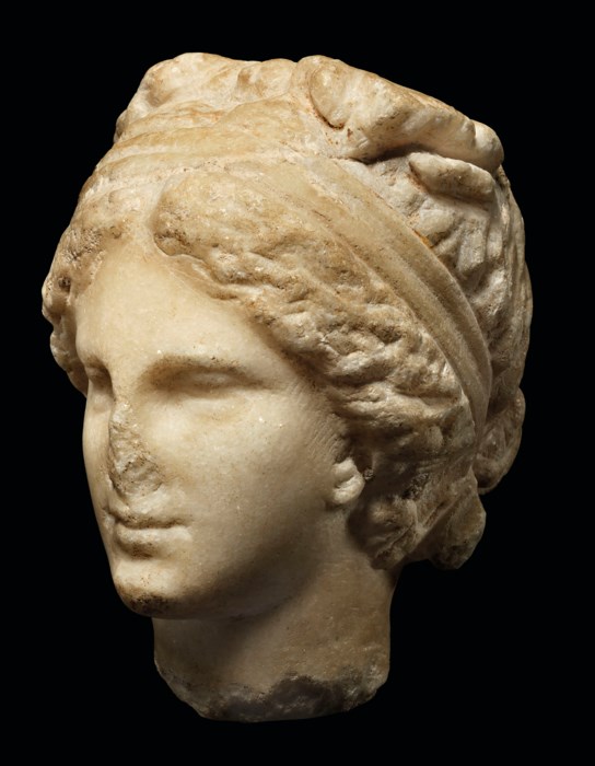 A GREEK MARBLE FEMALE HEAD, HELLENISTIC PERIOD, CIRCA 3RD CENTURY B.C ...