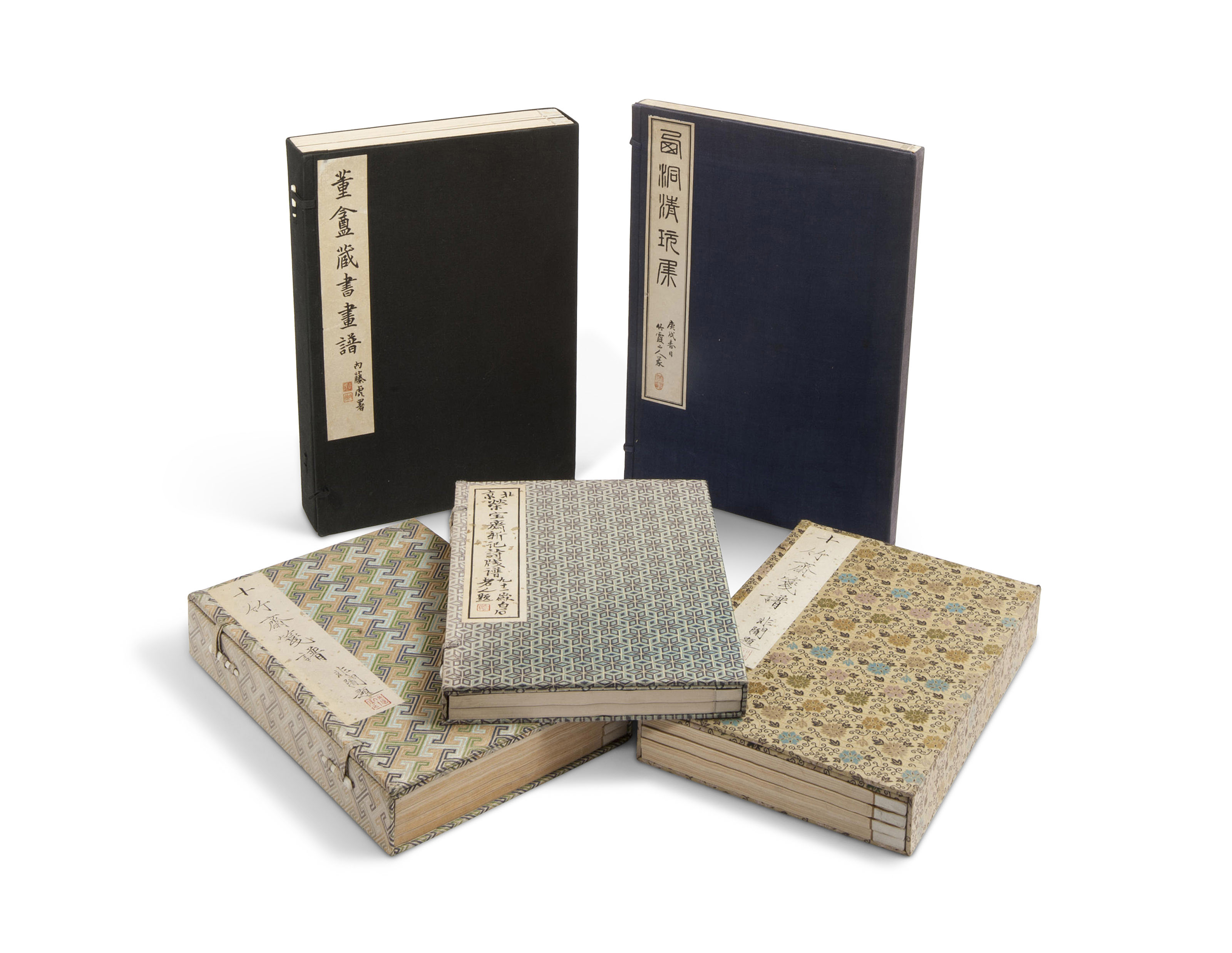 A GROUP OF THREE CHINESE WOODBLOCK PRINT BOOK SETS AND TWO JAPANESE ...