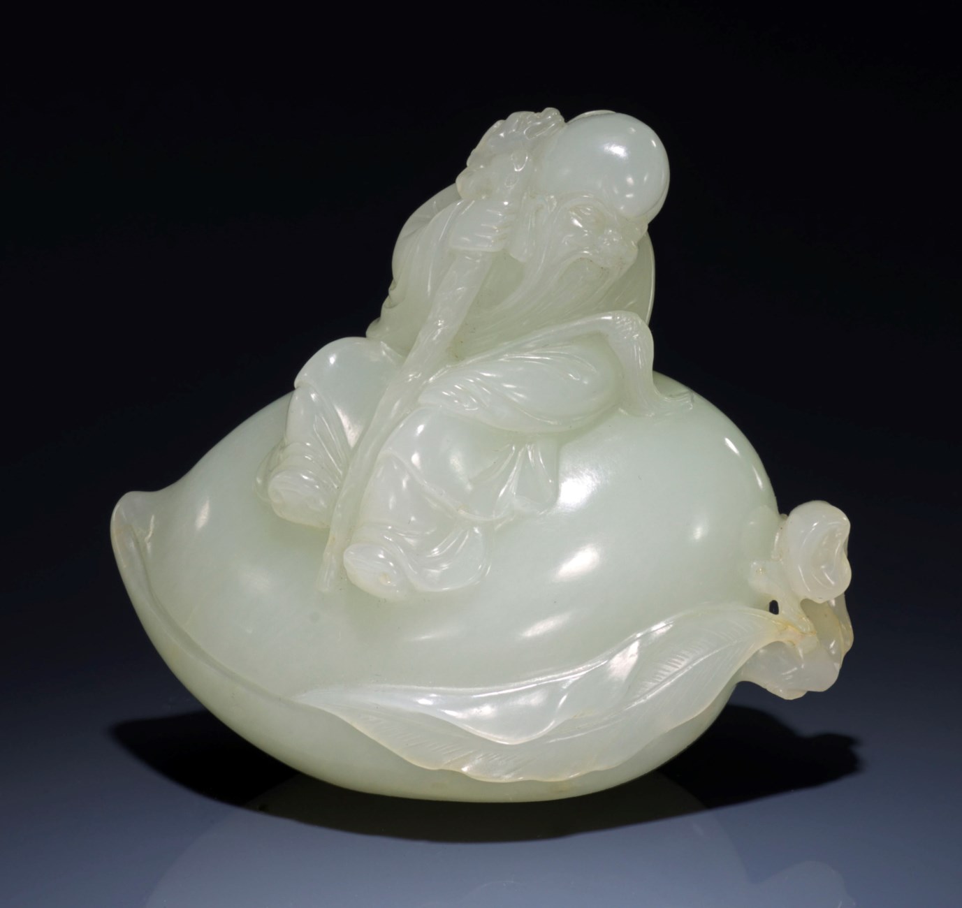 A WHITE JADE CARVING OF SHOULAO ON A PEACH, QING DYNASTY (1644-1911 ...