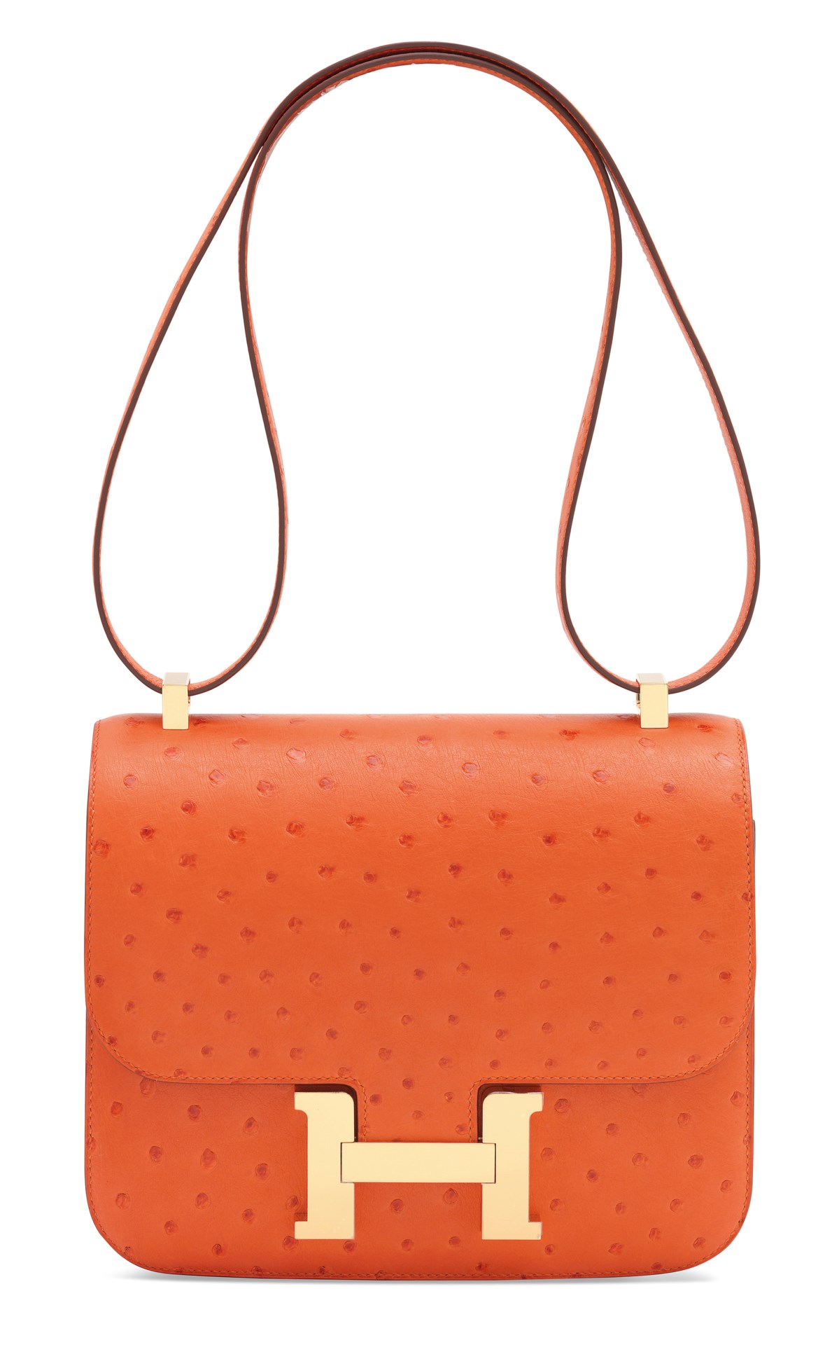 A TANGERINE OSTRICH CONSTANCE 24 WITH GOLD HARDWARE, HERMÈS, 2017 ...