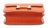 A TANGERINE OSTRICH CONSTANCE 24 WITH GOLD HARDWARE, HERMÈS, 2017 ...