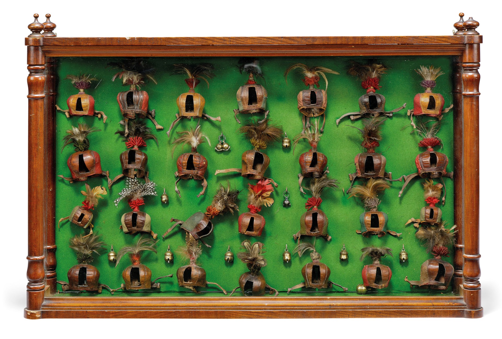 A DISPLAY OF TWENTY-EIGHT GERMAN FALCONRY HOODS, MID-19TH CENTURY ...