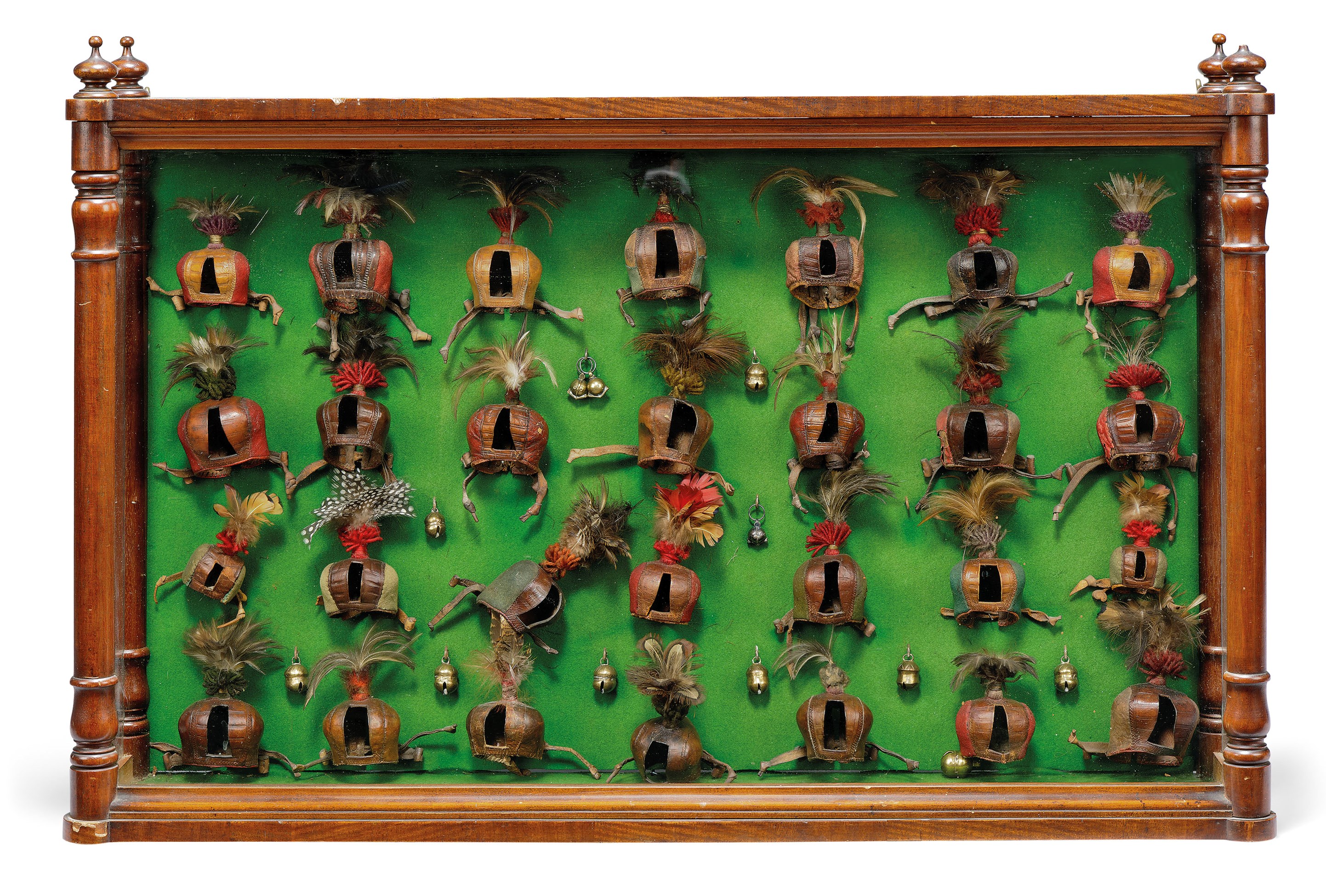 A DISPLAY OF TWENTY-EIGHT GERMAN FALCONRY HOODS, MID-19TH CENTURY ...