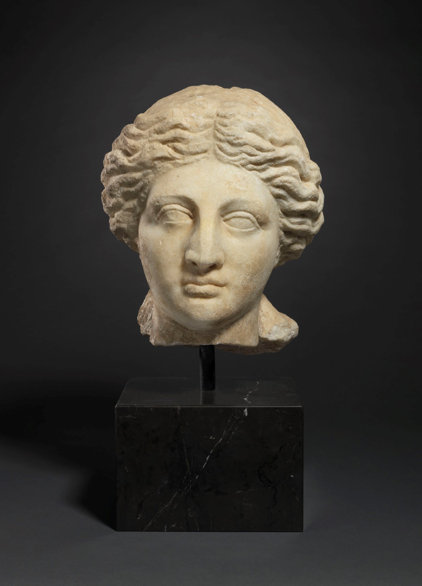 A GREEK MARBLE PORTRAIT HEAD OF A WOMAN, HELLENISTIC PERIOD, CIRCA MID ...
