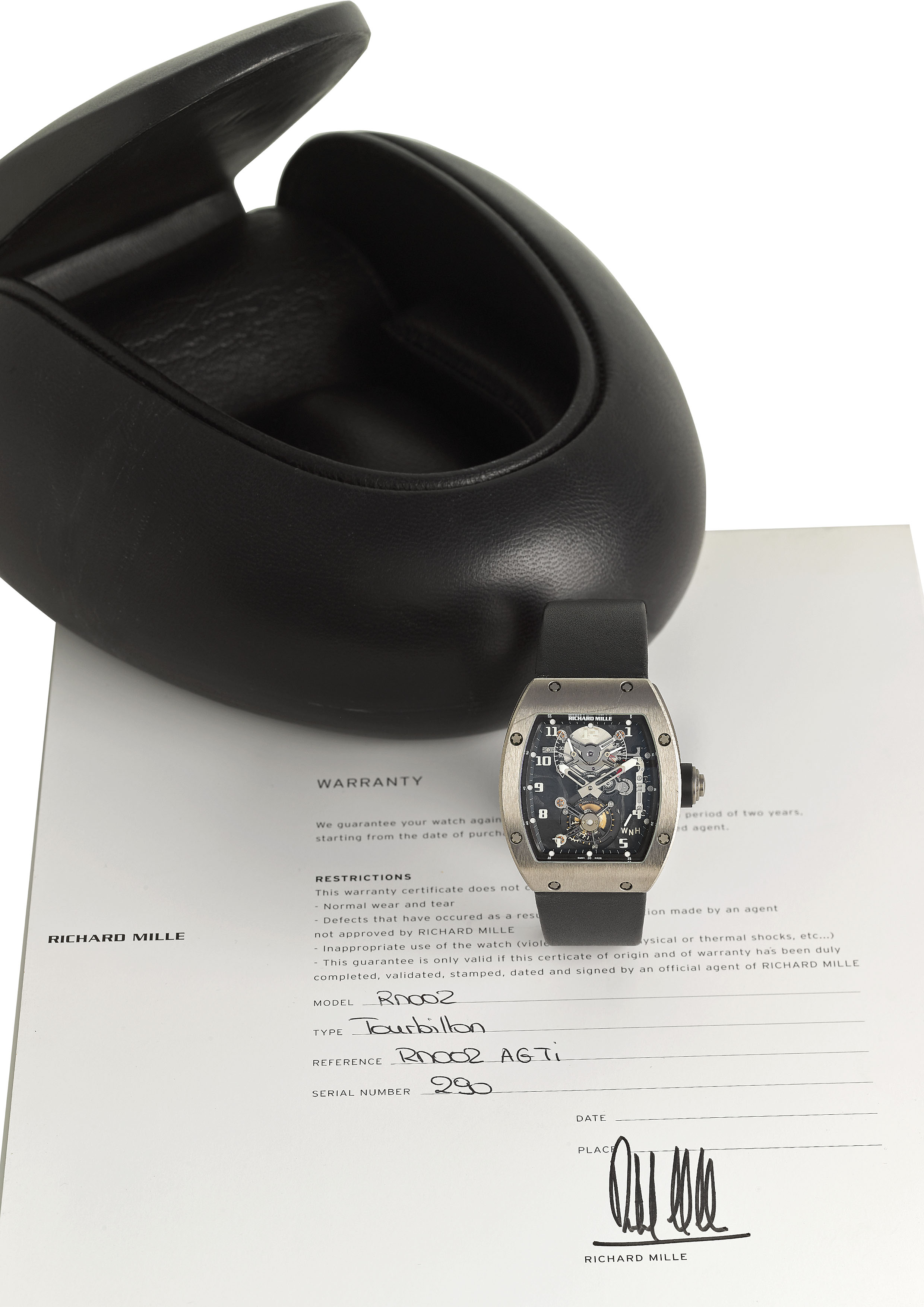 RICHARD MILLE. A FINE AND RARE TITANIUM SKELETONIZED TOURBILLON ...