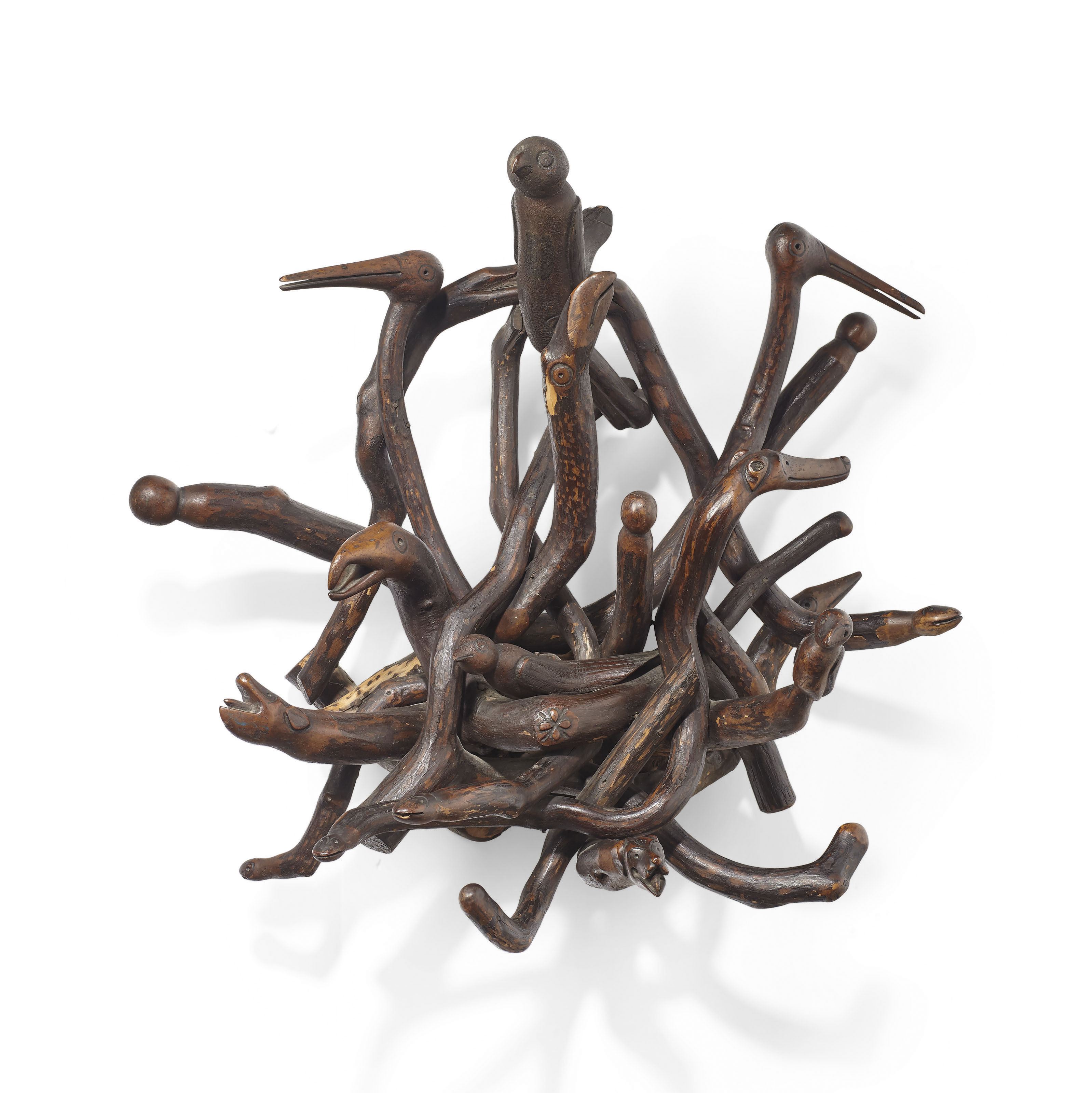 A Root-Form Wall-Mounted Construction Featuring Birds and Snakes