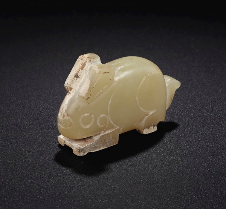 A PALE GREENISH-YELLOW JADE RABBIT-FORM PENDANT, LATE SHANG-EARLY ...