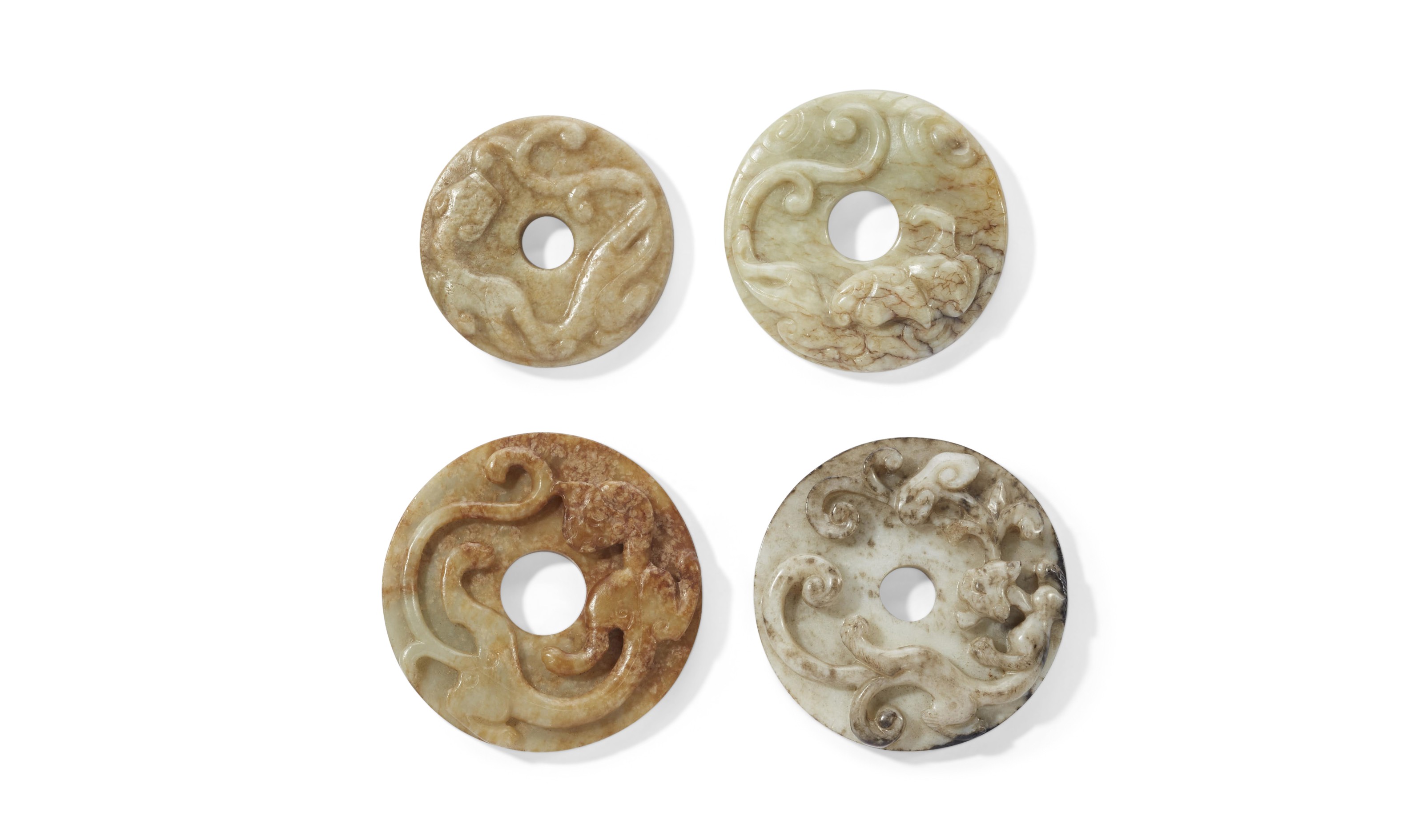 FOUR PALE GREY AND BEIGE JADE BI- DISCS, MING DYNASTY (1368-1644 ...