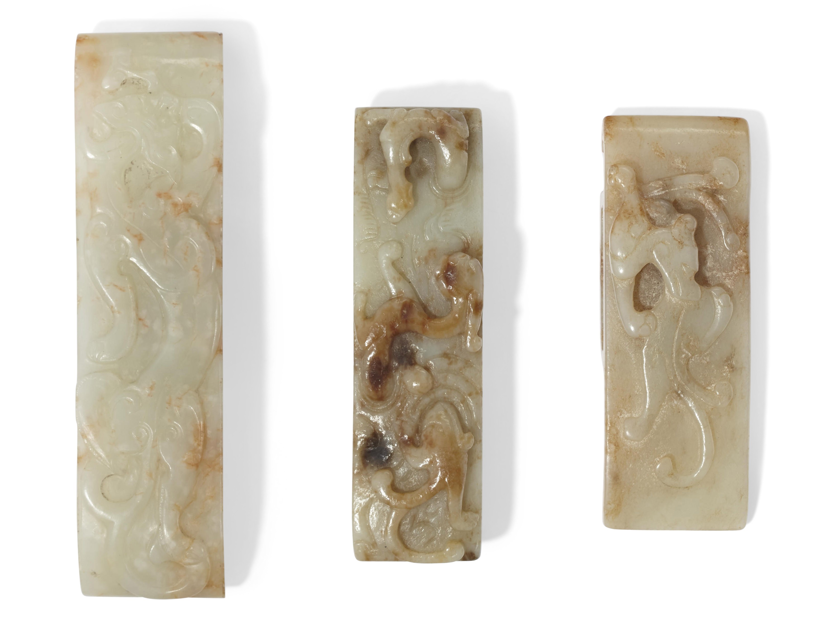 THREE CREAMY-GREY JADE SWORD SLIDES, MING-EARLY QING DYNASTY | Christie’s