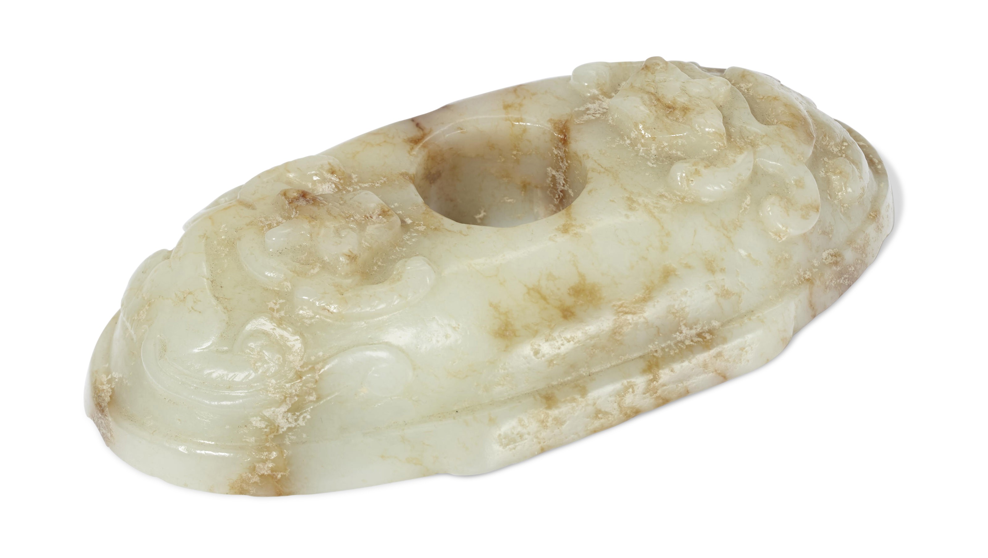 A PALE CREAMY-WHITE AND BROWN JADE FITTING, MING DYNASTY (1368-1644 ...