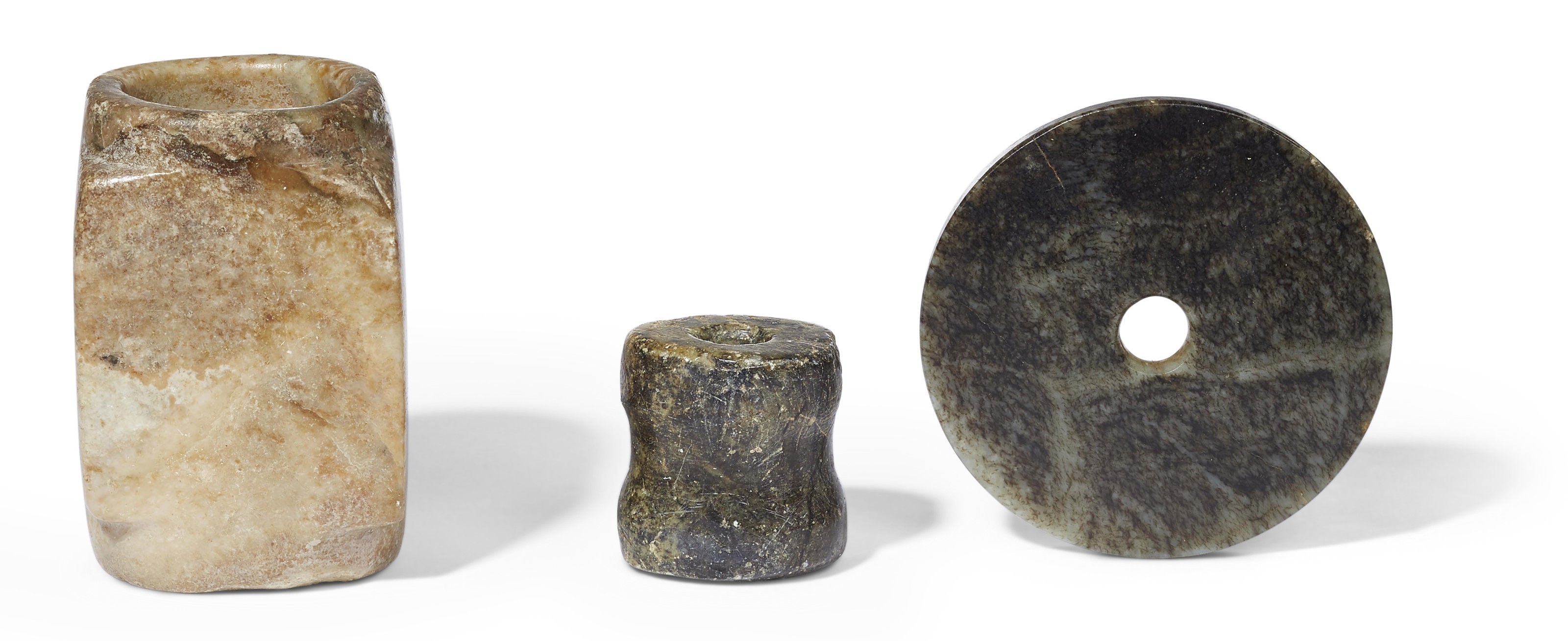 A MOTTLED CREAMY-BEIGE JADE CONG, | Christie’s