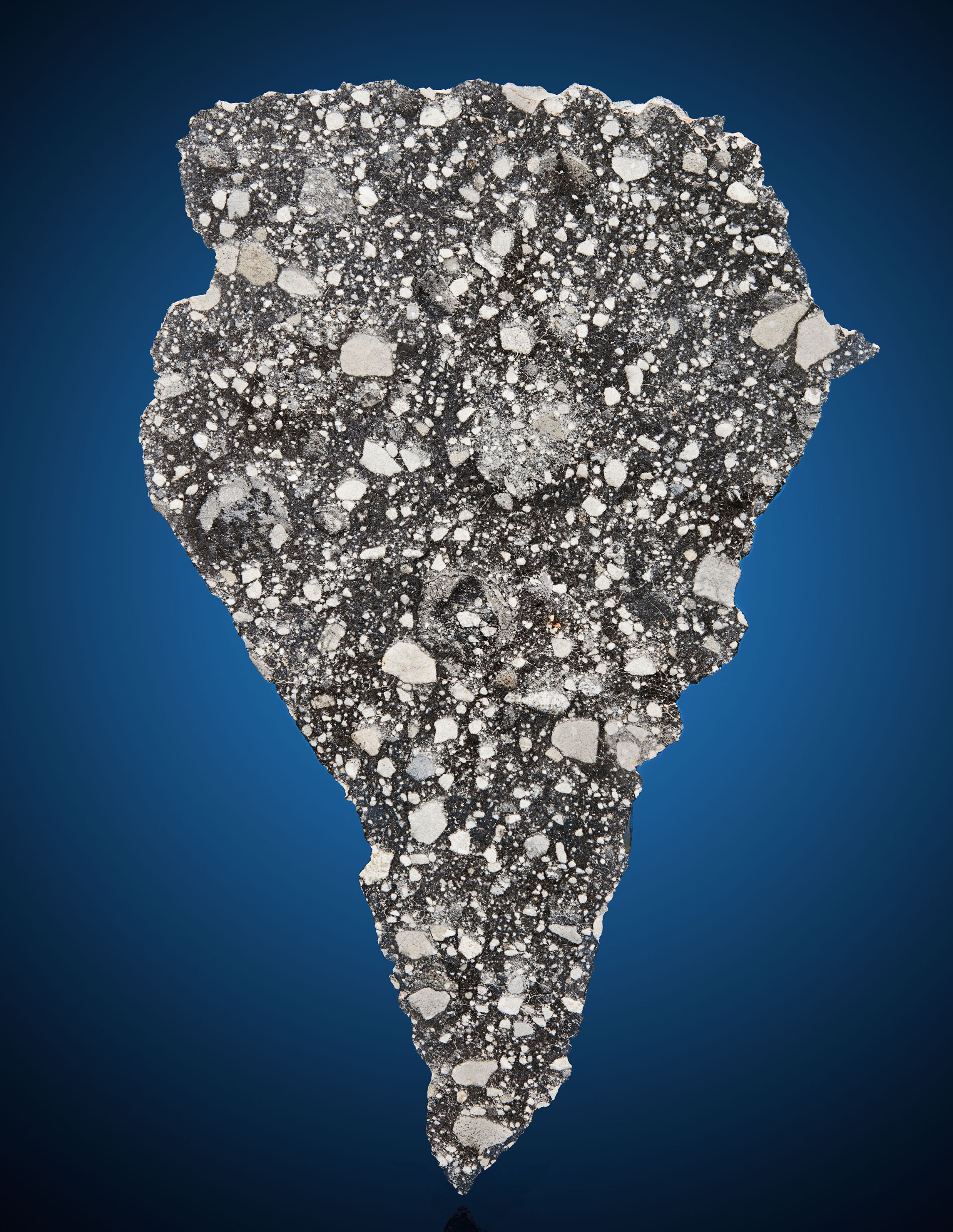 A TRIANGULAR SPECIMEN OF THE MOON — END PIECE REVEALS INTERIOR AND ...