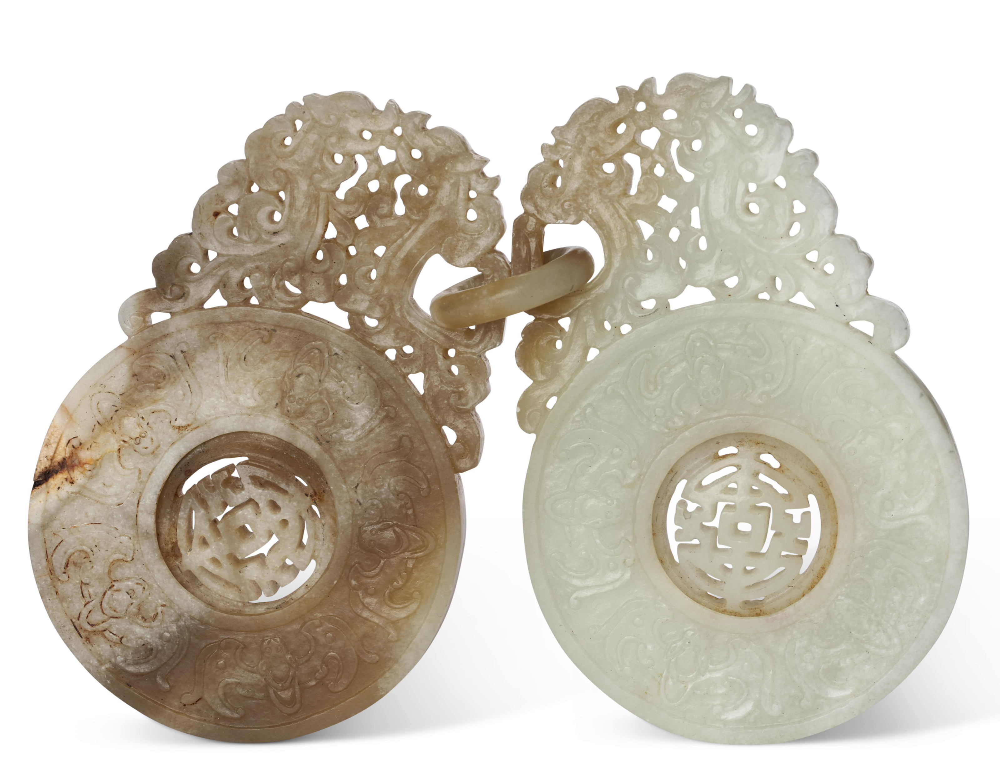 A PAIR OF CONJOINED WHITE AND BEIGE JADE PLAQUES, | Christie’s