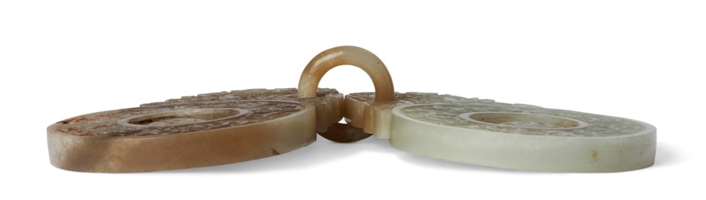 A PAIR OF CONJOINED WHITE AND BEIGE JADE PLAQUES, | Christie’s