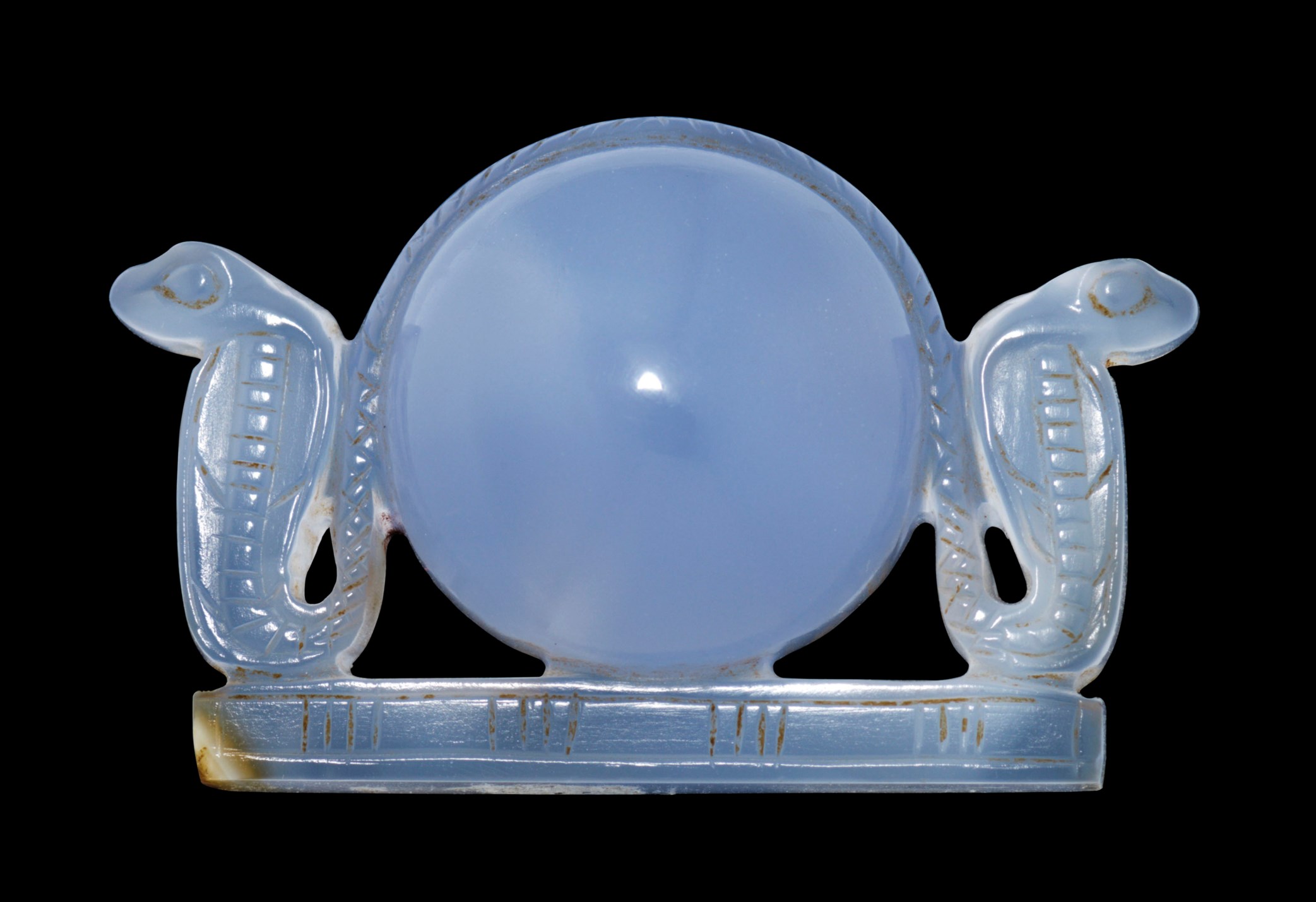 AN EGYPTIAN BLUE CHALCEDONY HORUS-BEHDET AMULET, LATE PERIOD TO ...