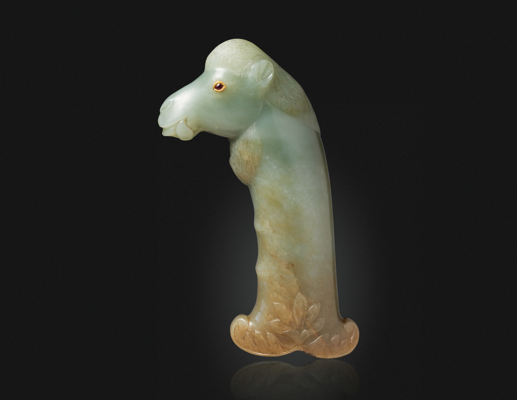 A CAMEL-HEADED CARVED JADE DAGGER HILT