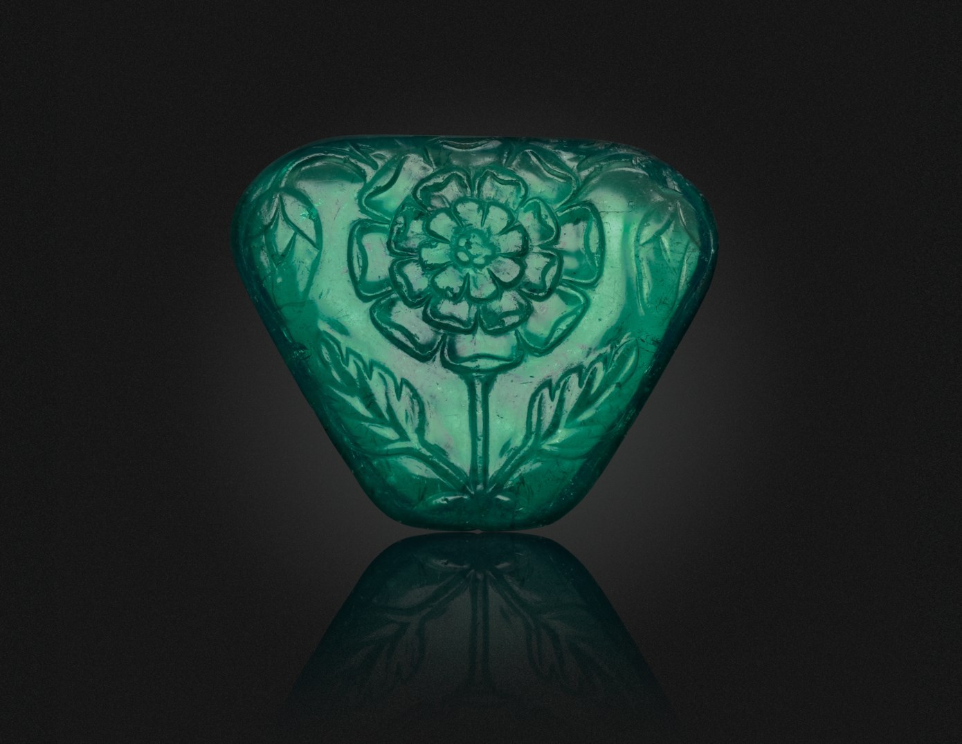 A CARVED EMERALD | Christie's