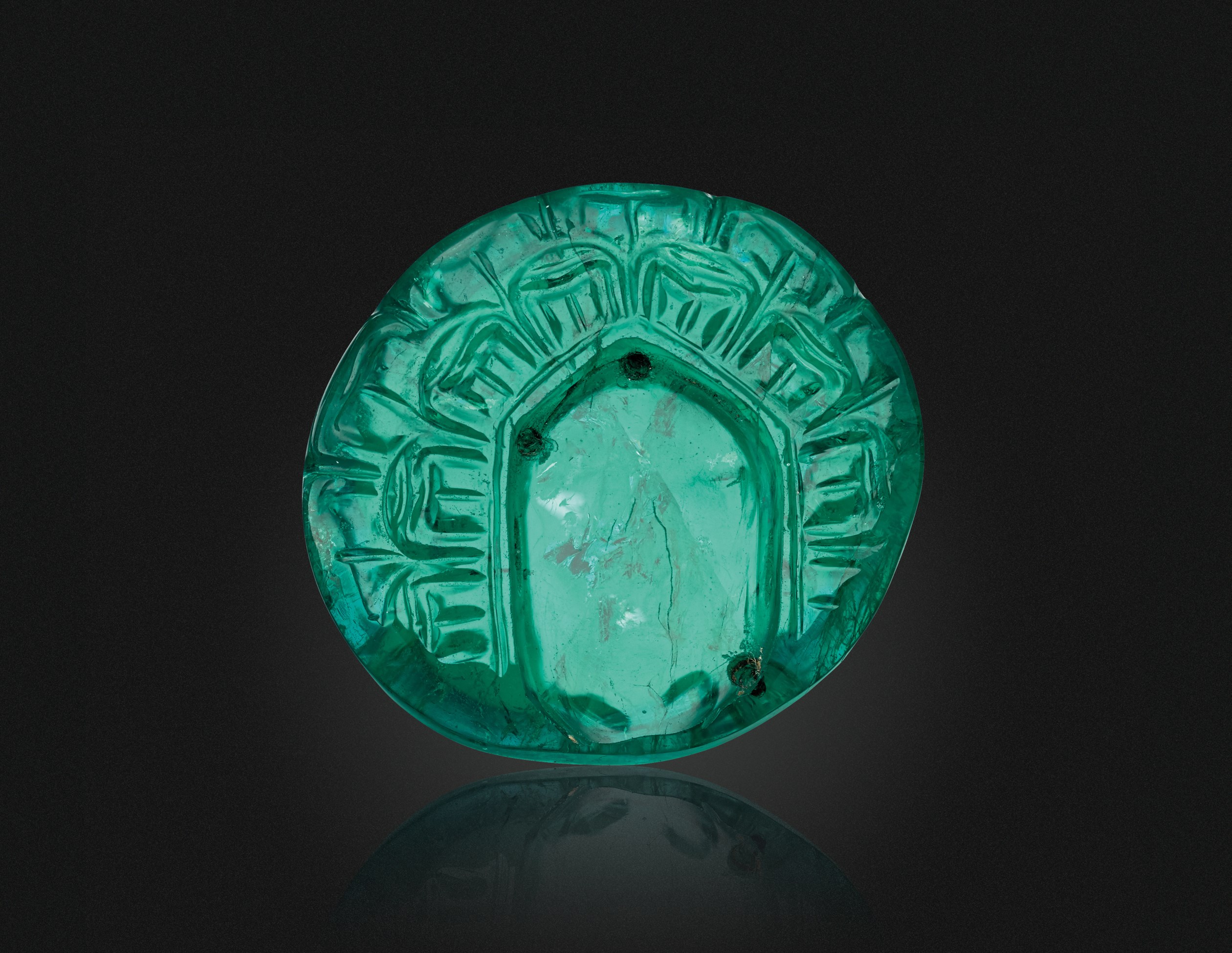 A CARVED EMERALD | Christie's