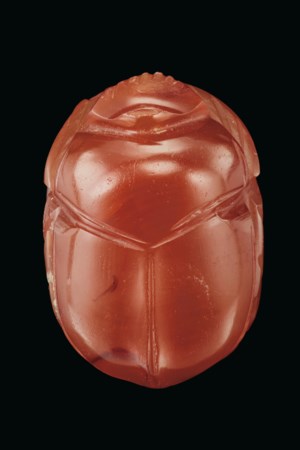 A GREEK CARNELIAN SCARAB WITH A YOUTH SHOULDERING A RAM