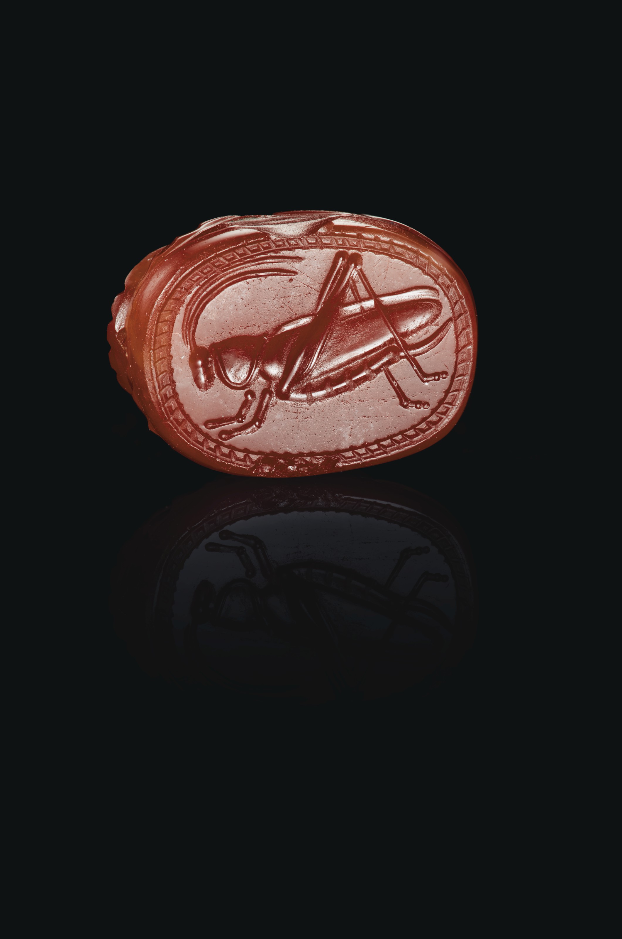 A GREEK CARNELIAN SCARAB WITH A NUDE ARCHER, ARCHAIC PERIOD, CIRCA ...