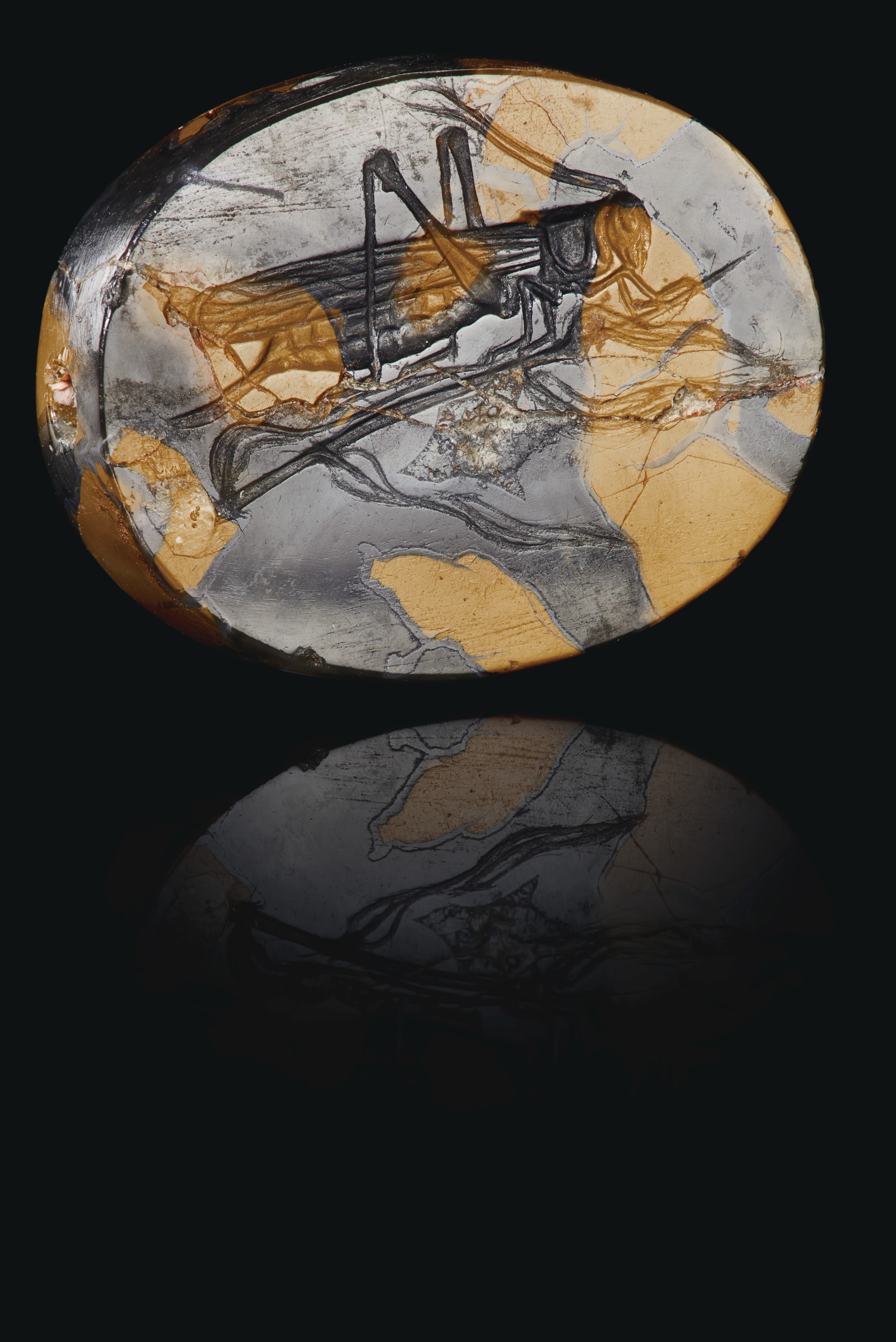 A GREEK CARNELIAN SCARAB WITH A NUDE ARCHER, ARCHAIC PERIOD, CIRCA ...