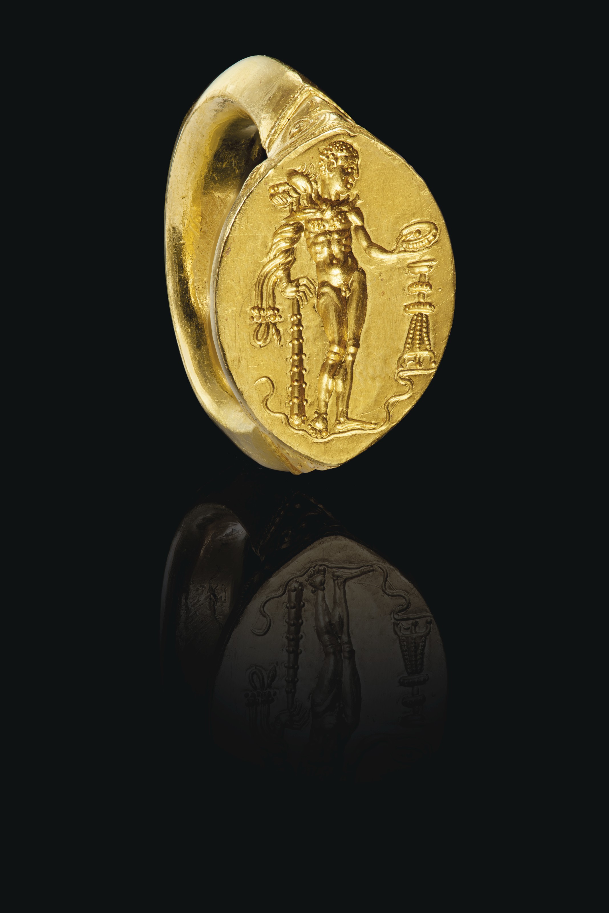 A GREEK CARNELIAN SCARAB WITH A NUDE ARCHER, ARCHAIC PERIOD, CIRCA ...