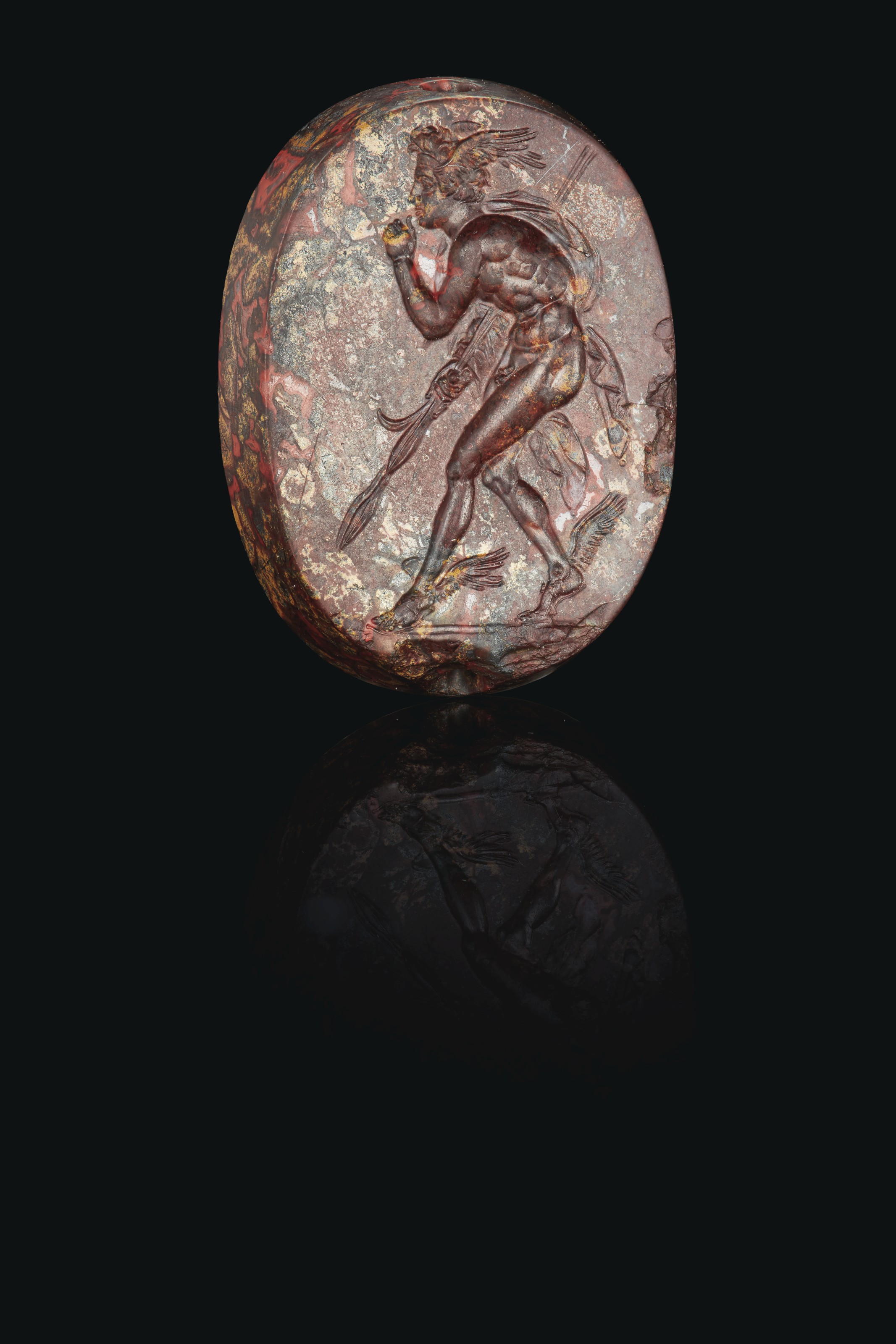 A GREEK CARNELIAN SCARAB WITH A NUDE ARCHER, ARCHAIC PERIOD, CIRCA ...