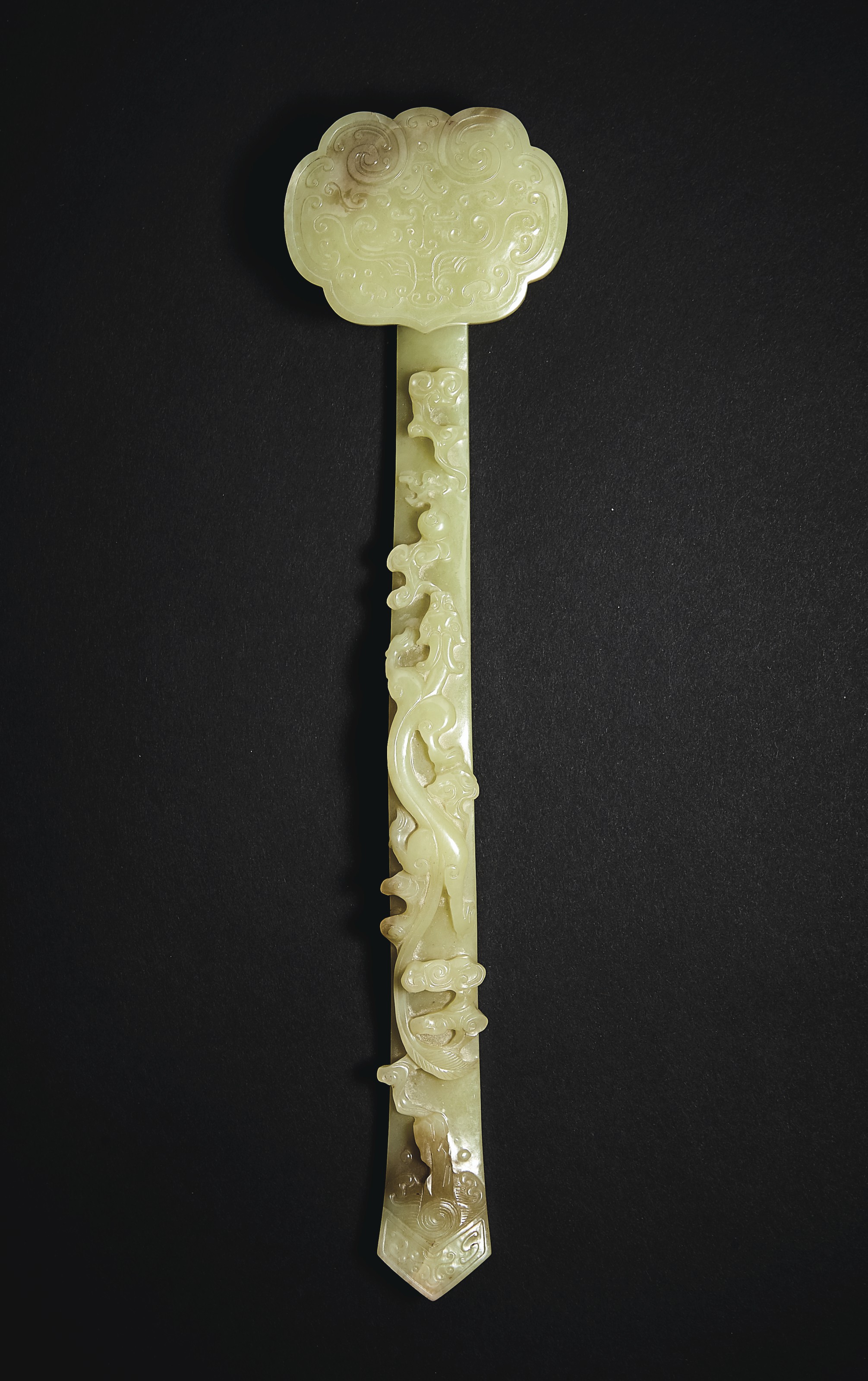 A YELLOWISH-GREEN JADE RUYI SCEPTER