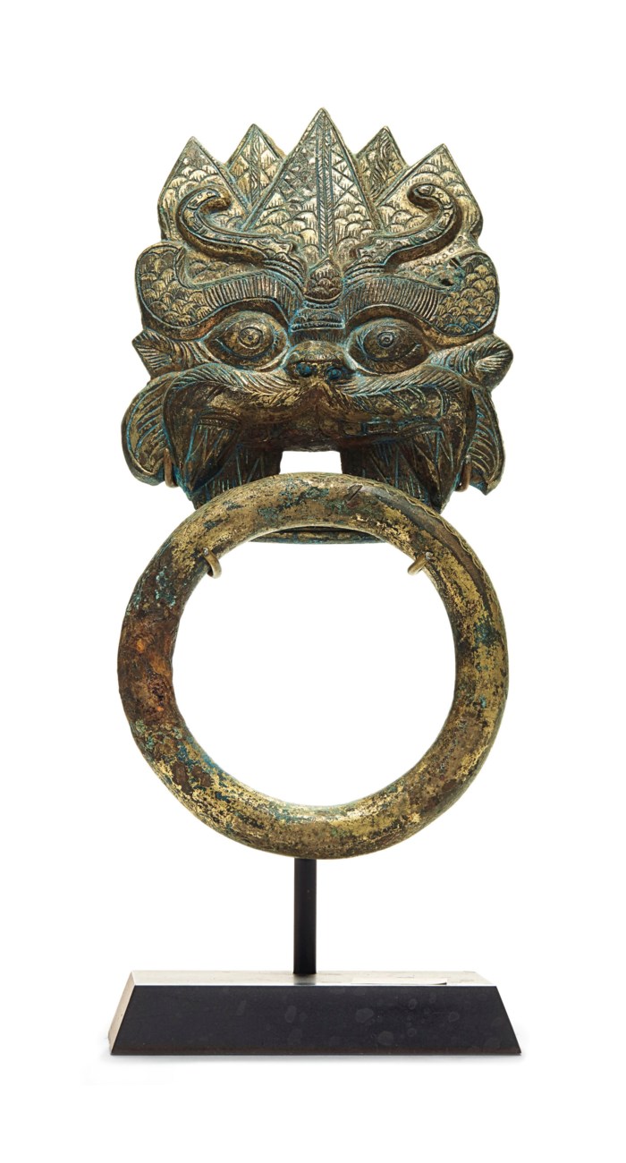 A GILT-BRONZE TAOTIE MASK AND LOOSE-RING HANDLE, CHINA, SIX DYNASTIES ...