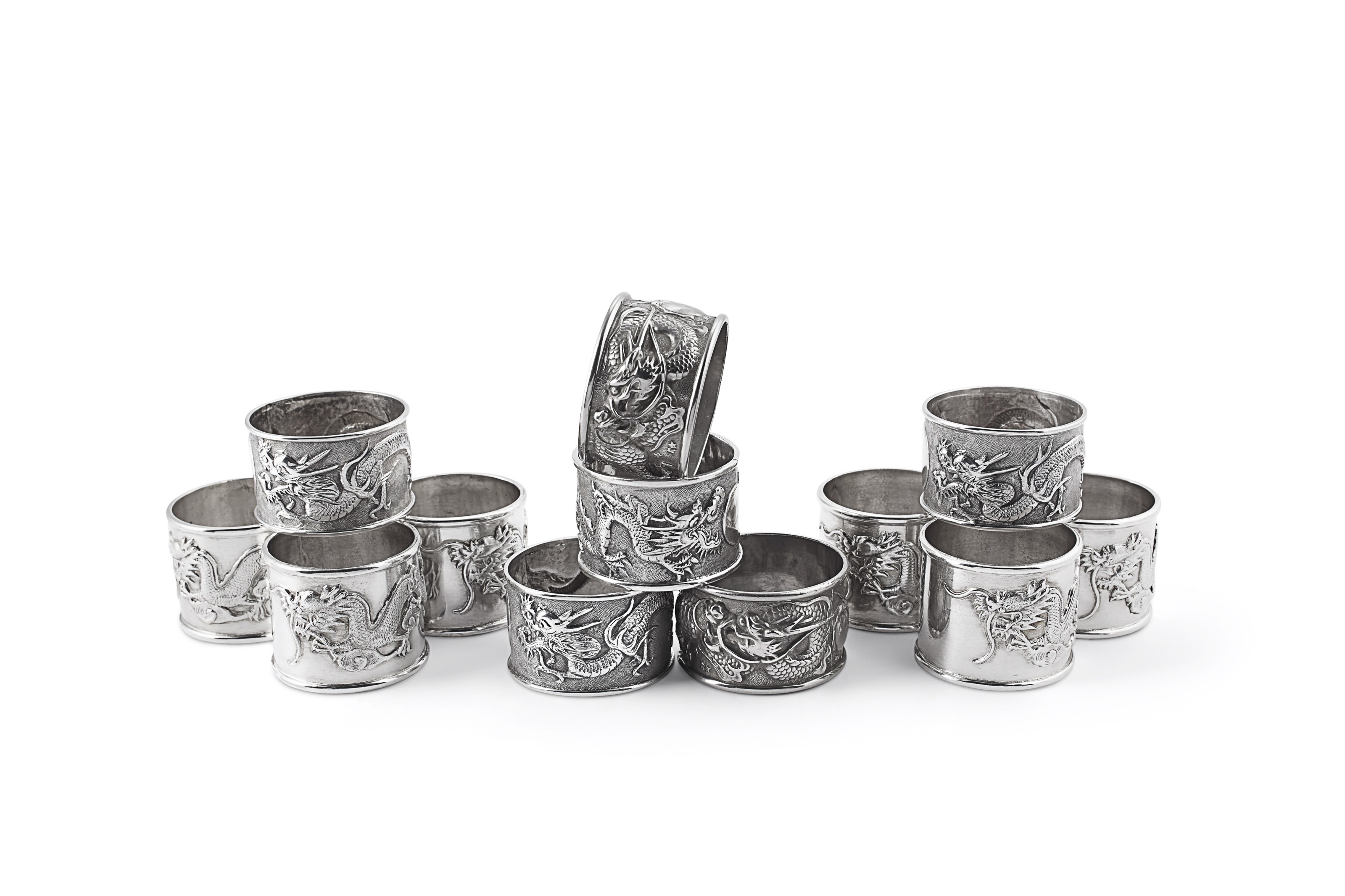 A GROUP OF TWELVE CHINESE EXPORT SILVER NAPKIN RINGS, VARIOUS MAKERS ...