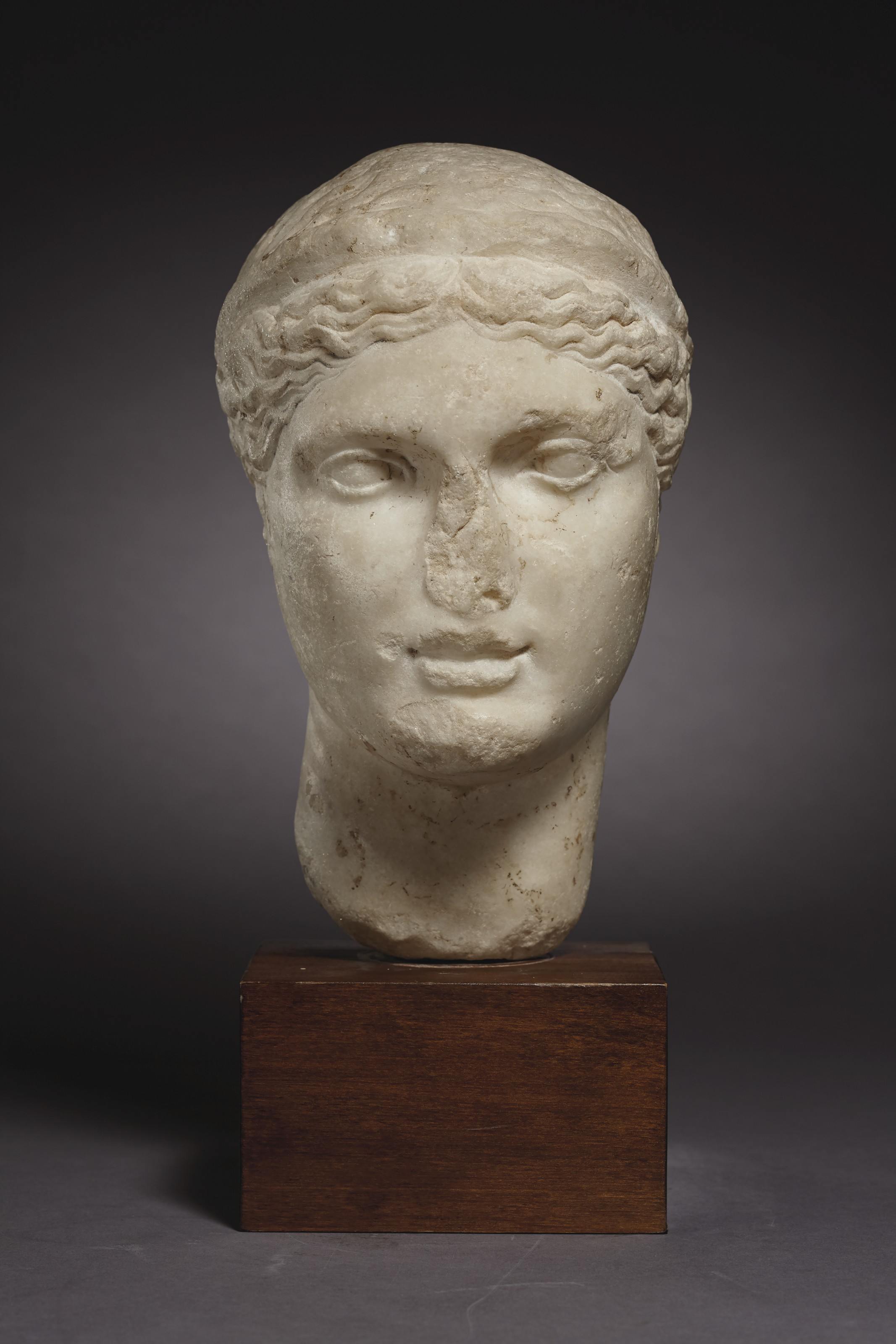 A GREEK TERRACOTTA FEMALE HEAD, TARENTINE, HELLENISTIC PERIOD, CIRCA ...