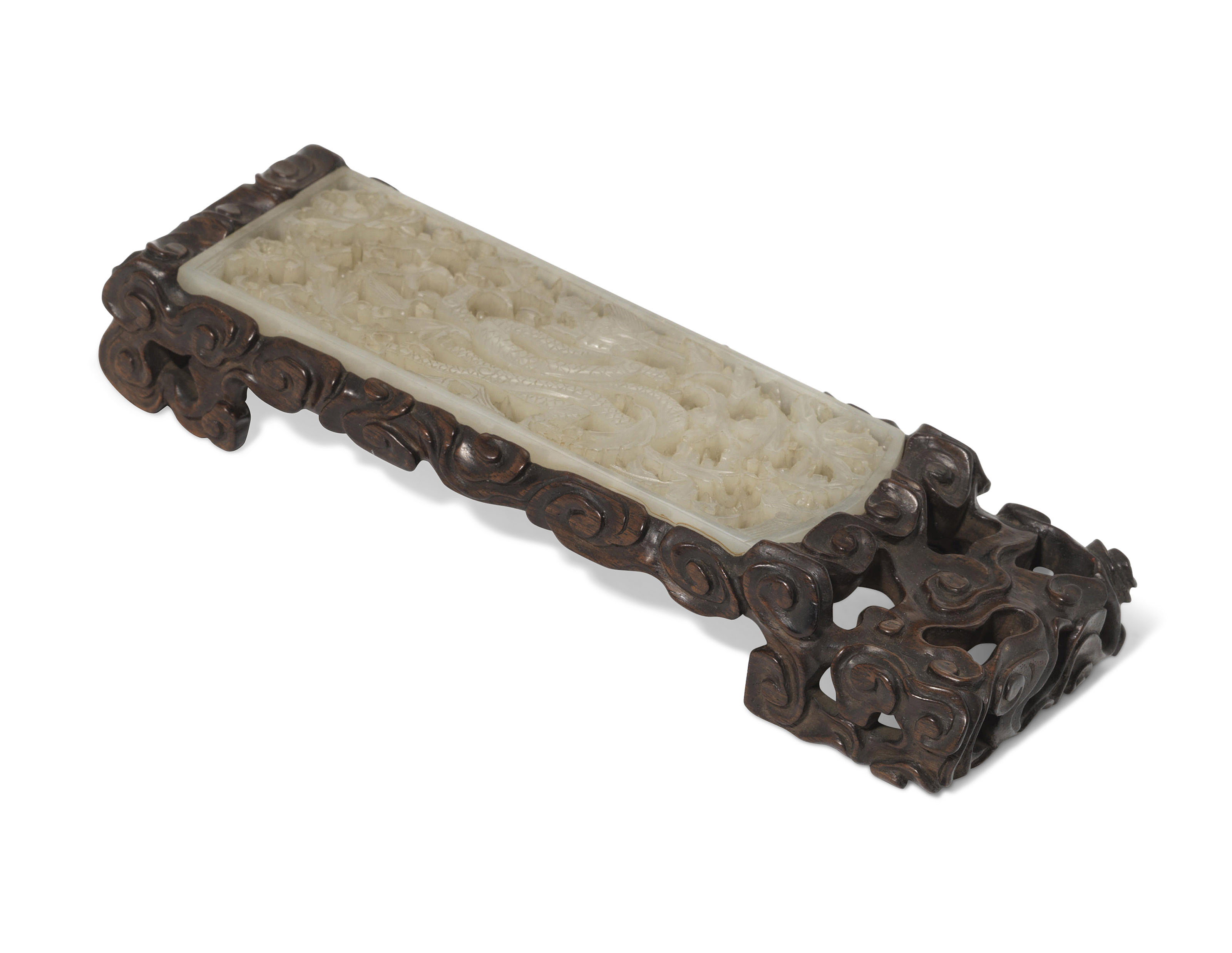 A WHITE JADE RETICULATED 'DRAGON' PLAQUE MOUNTED AS A BRUSH REST, THE ...