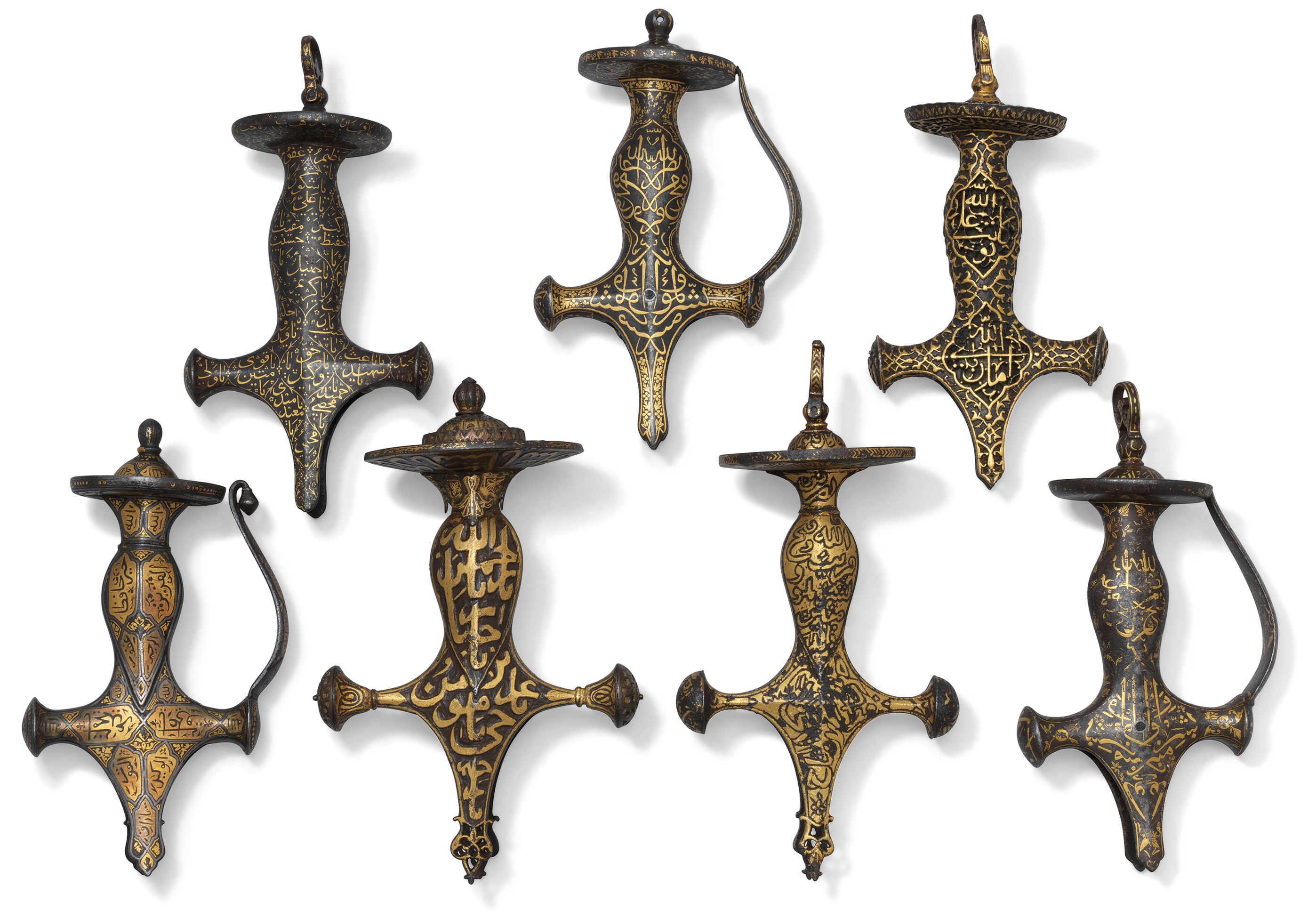 SEVEN GOLD-OVERLAID SWORD (TULWAR) HILTS, MUGHAL OR DECCAN INDIA, 17TH ...